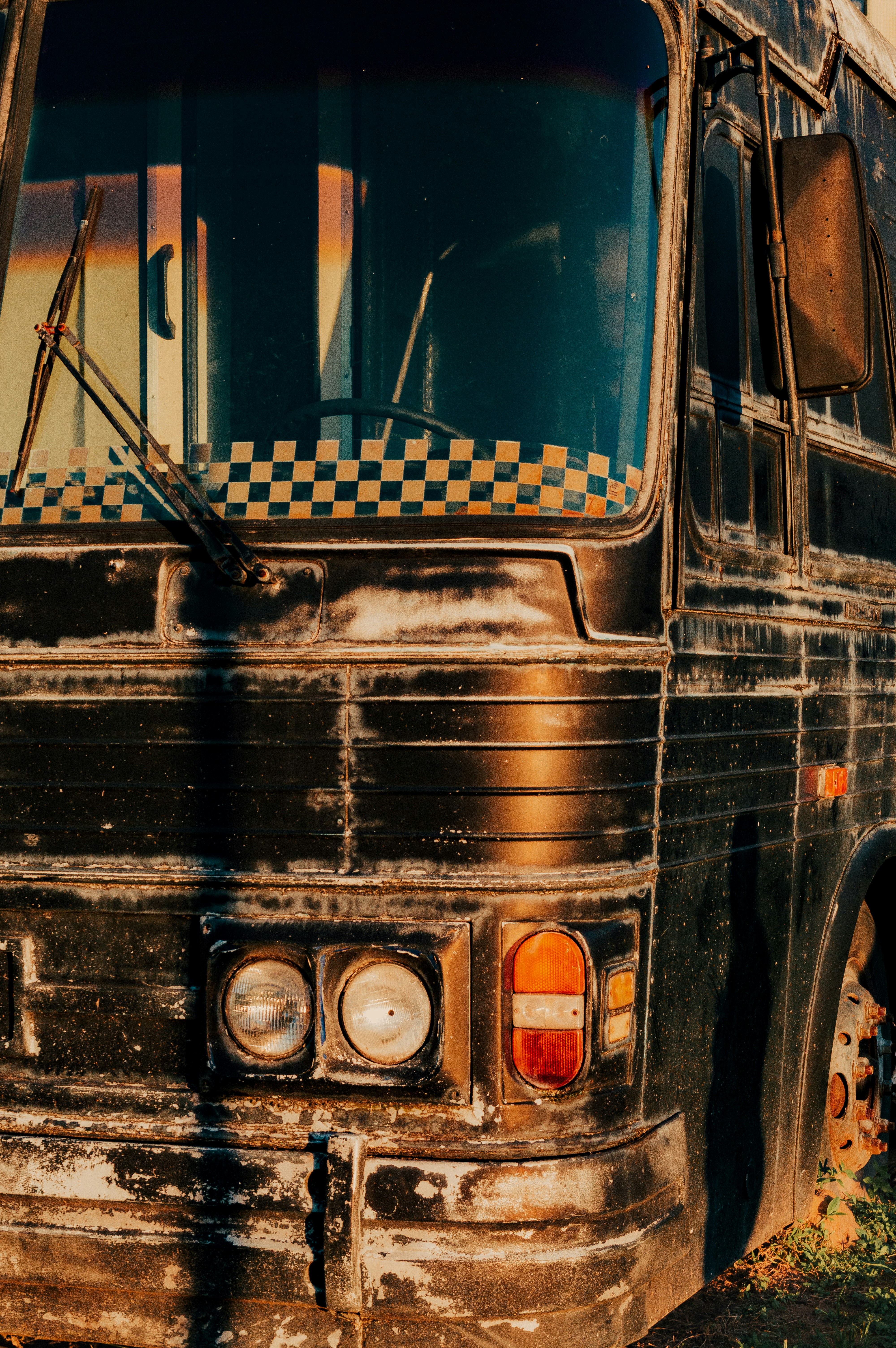 Rust and Reflection: The Grimy Bus Stares Back