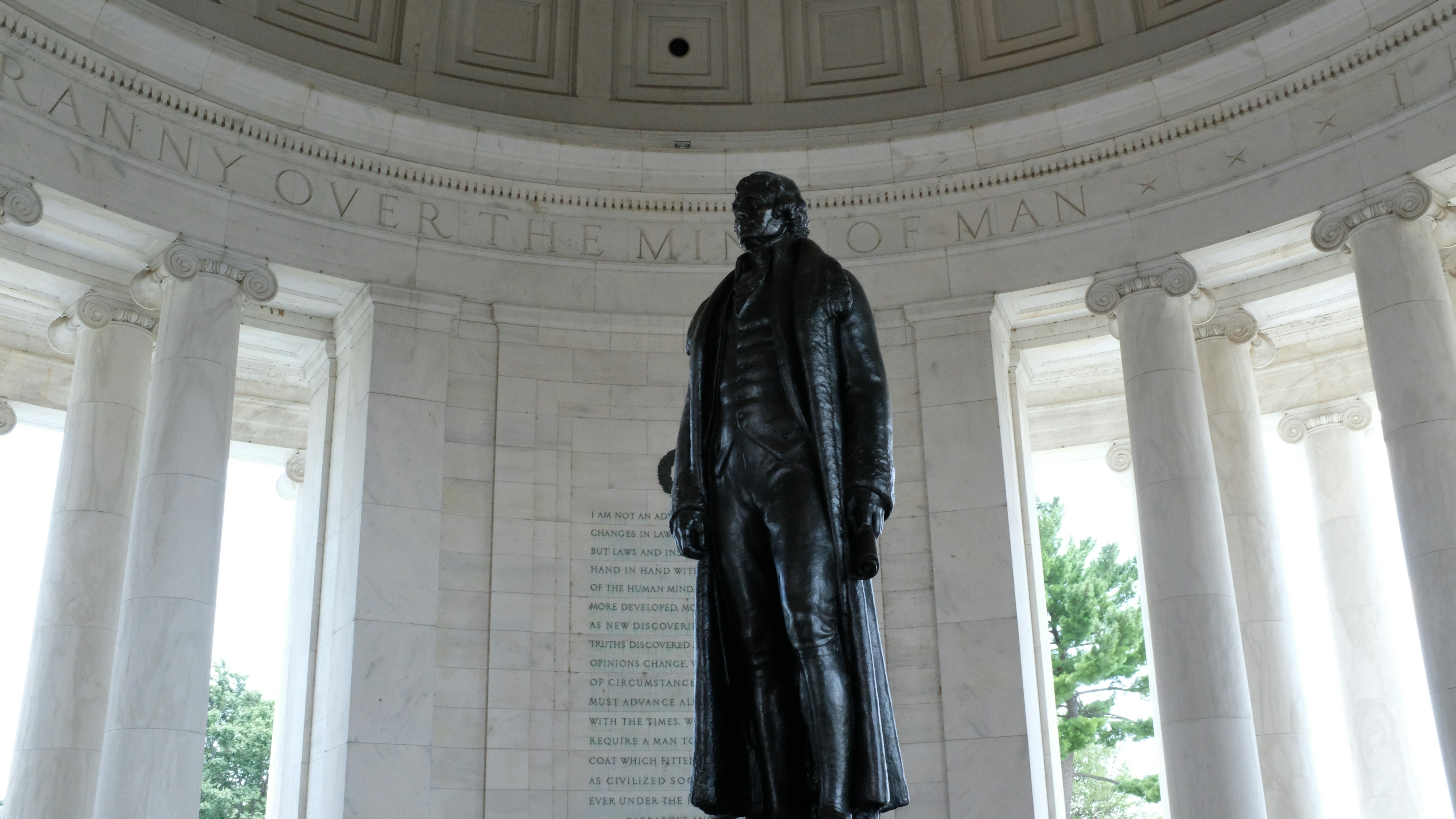 The bronze statue of Thomas Jefferson stands as the centerpiece of his memorial in Washington, D.C.Designed by sculptor Rudolph Evans, the statue was added to the memorial in 1947, replacing a plaster version used during the initial dedication due to metal shortages during World War II. He is encircled by his most famous writings, including the quote visible above him: "I have sworn upon the altar of God eternal hostility against every form of tyranny over the mind of man."