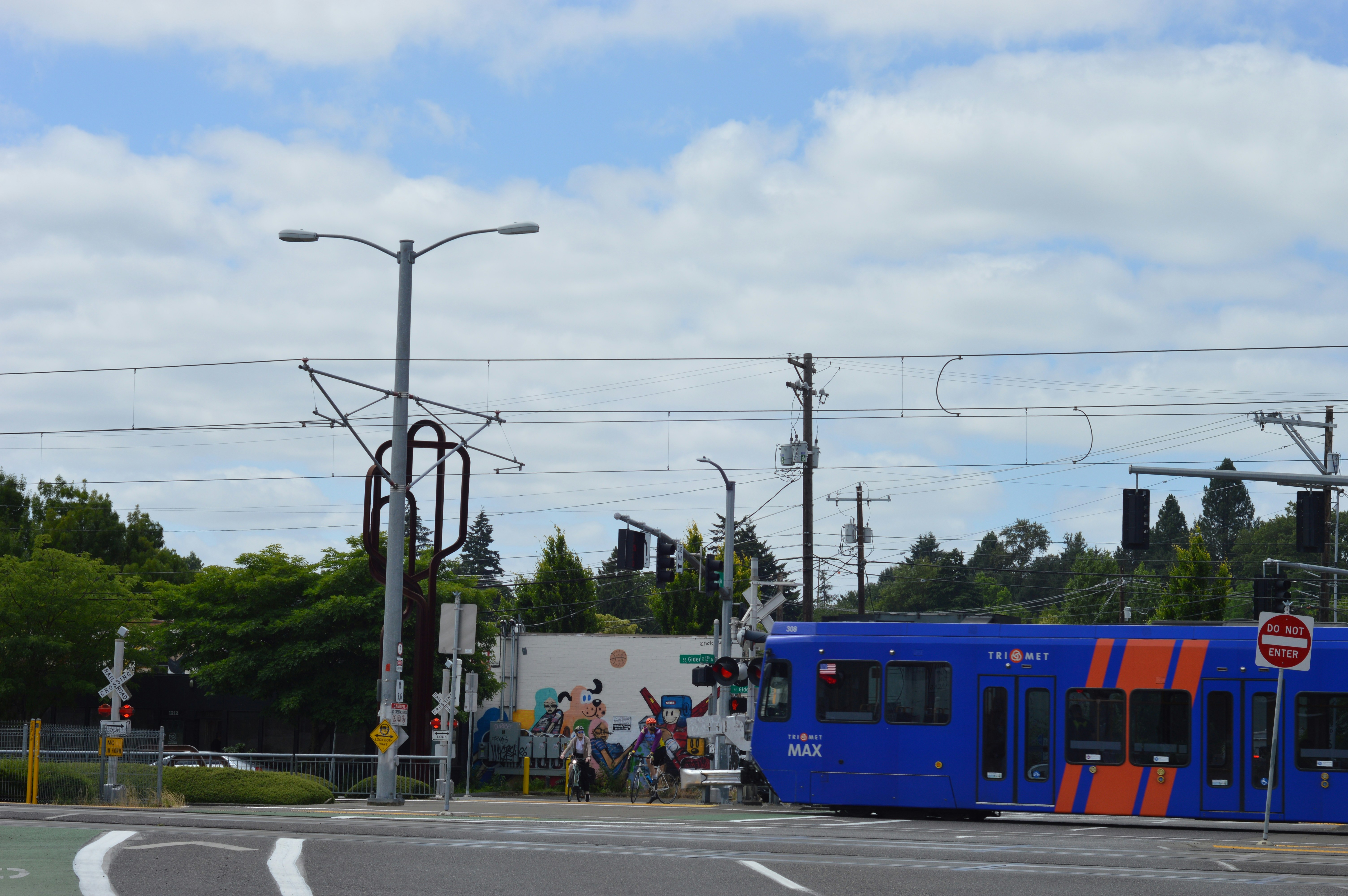 Blue Commuter on Rails: a City Crossing Moment