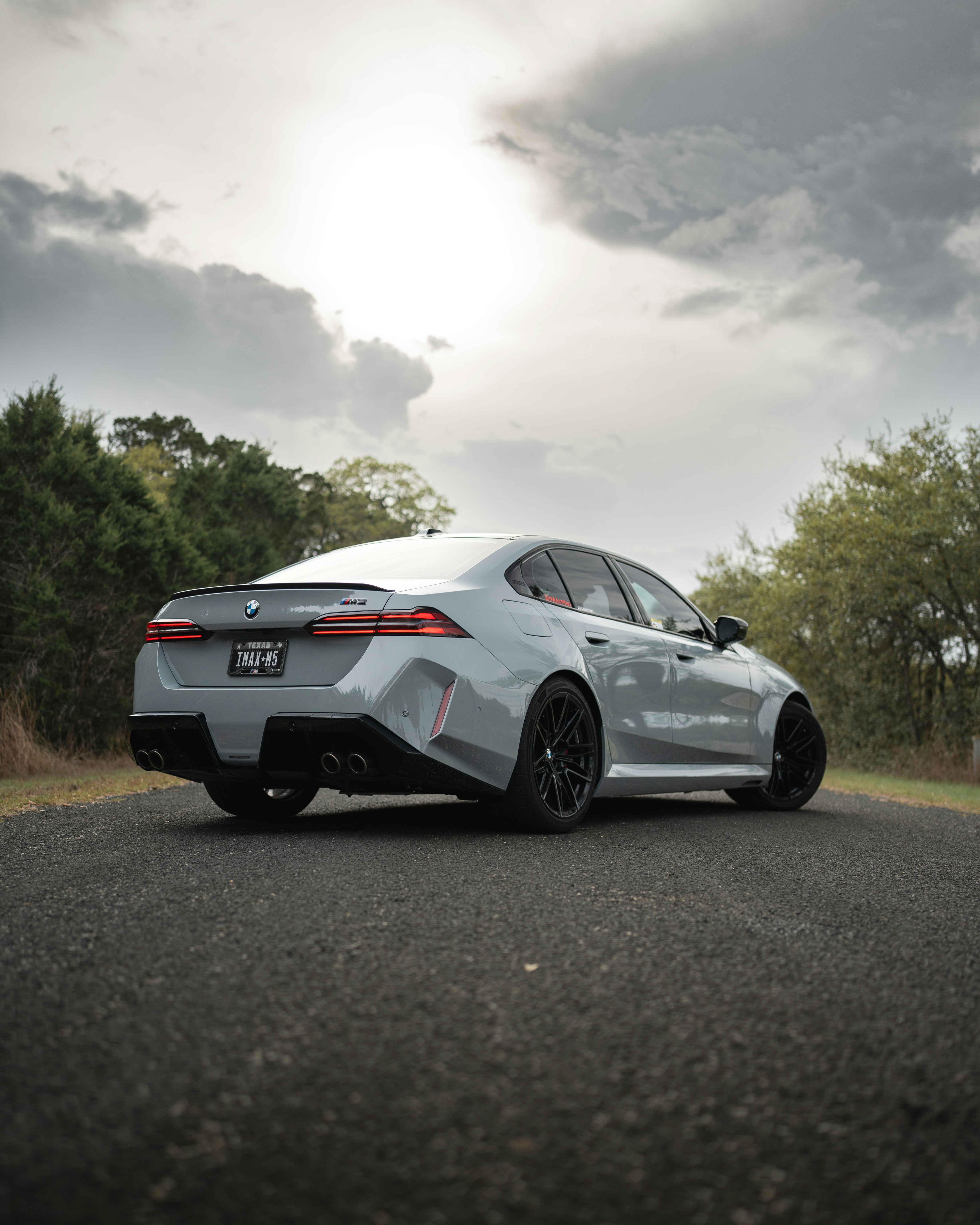 Distant Sunlit Drive: BMW M near the Horizon