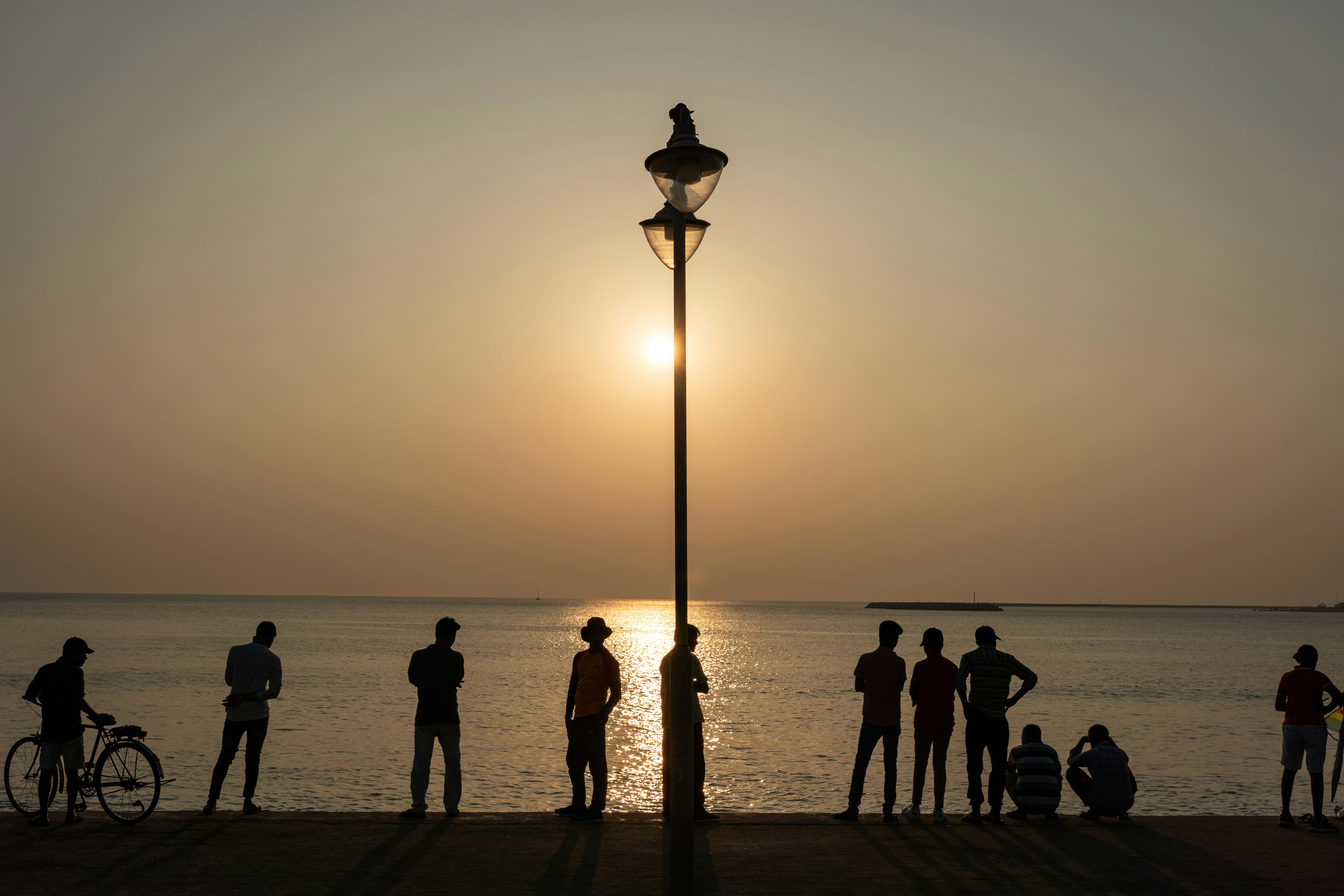 Sunlit Pier: silhouettes at golden hour