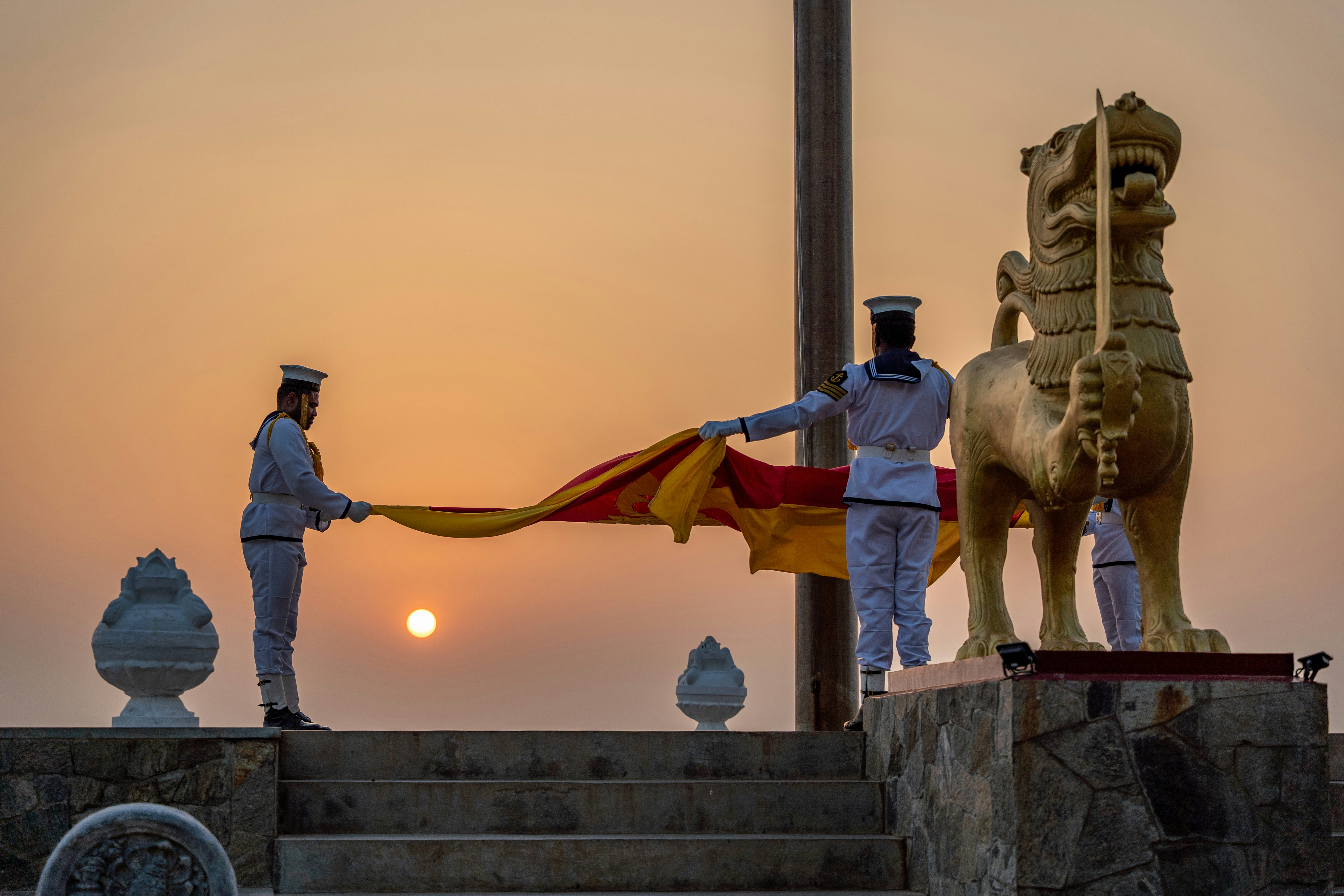 Silhouetted Ceremonial Rite at Sunset