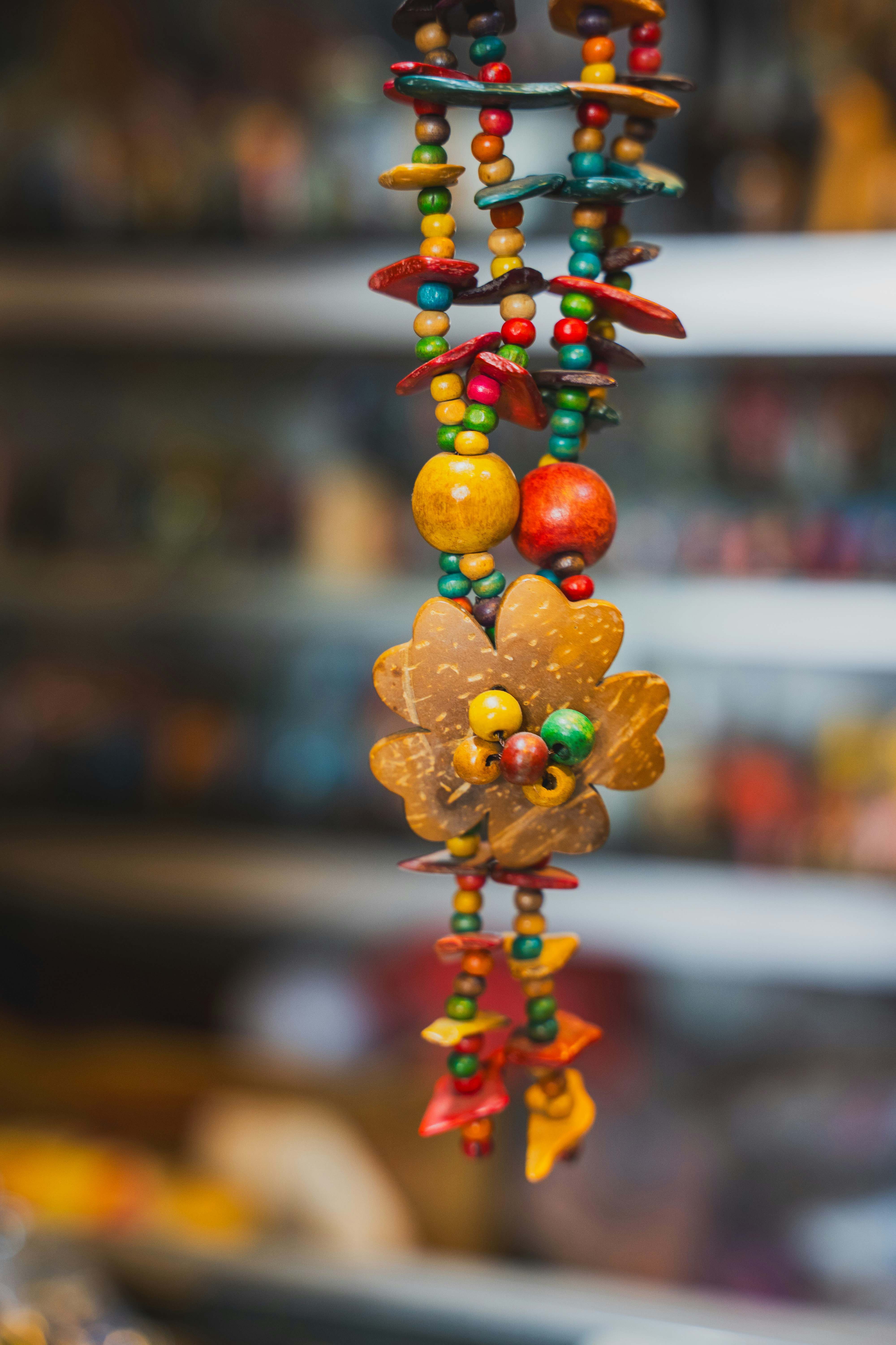 Hanging Bead Garland with Floral Charm in Soft Focus