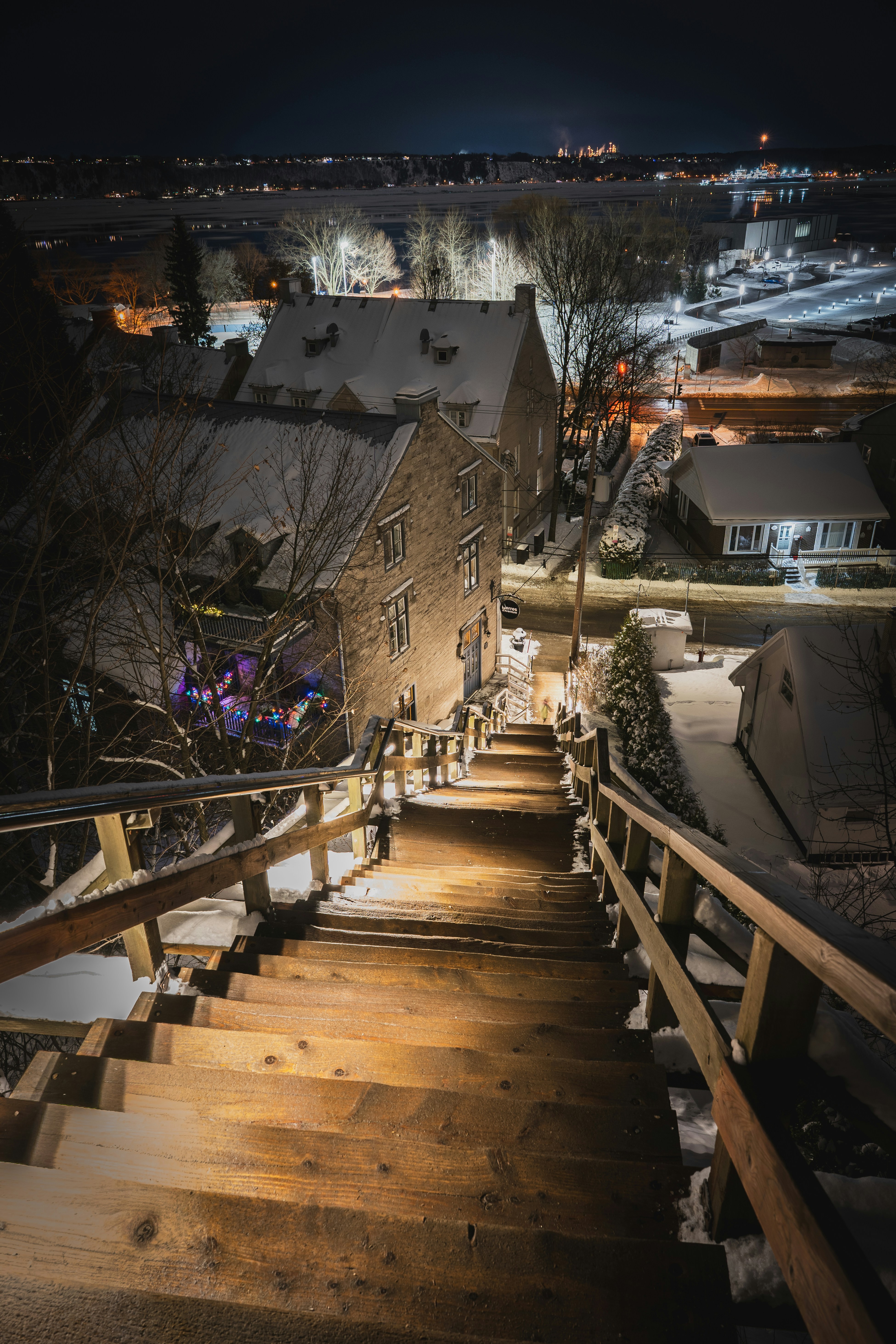 Snowy staircase to a quiet town at night