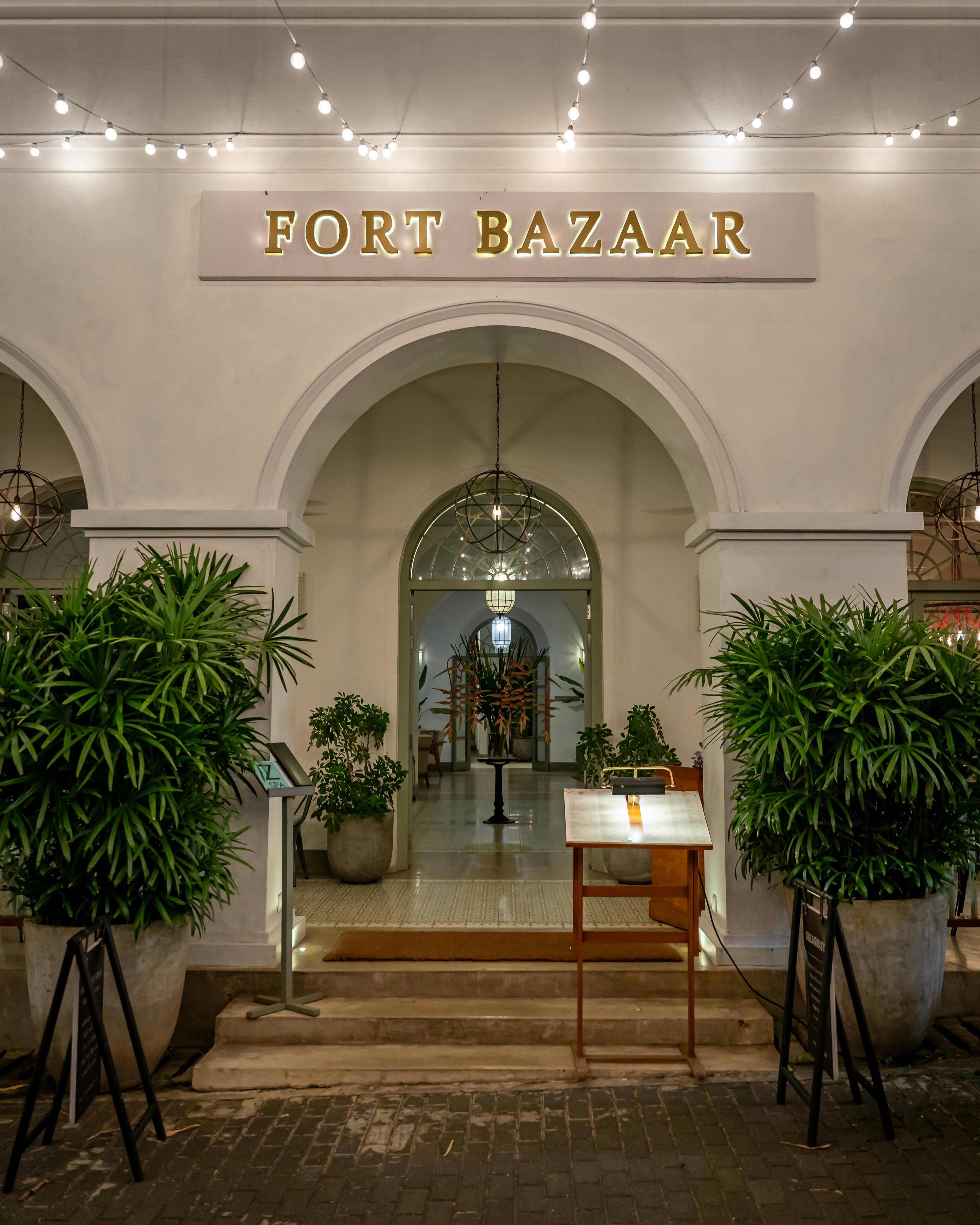Fort Bazaar Entrance: Soft Glow Under Arched Harbor of Light