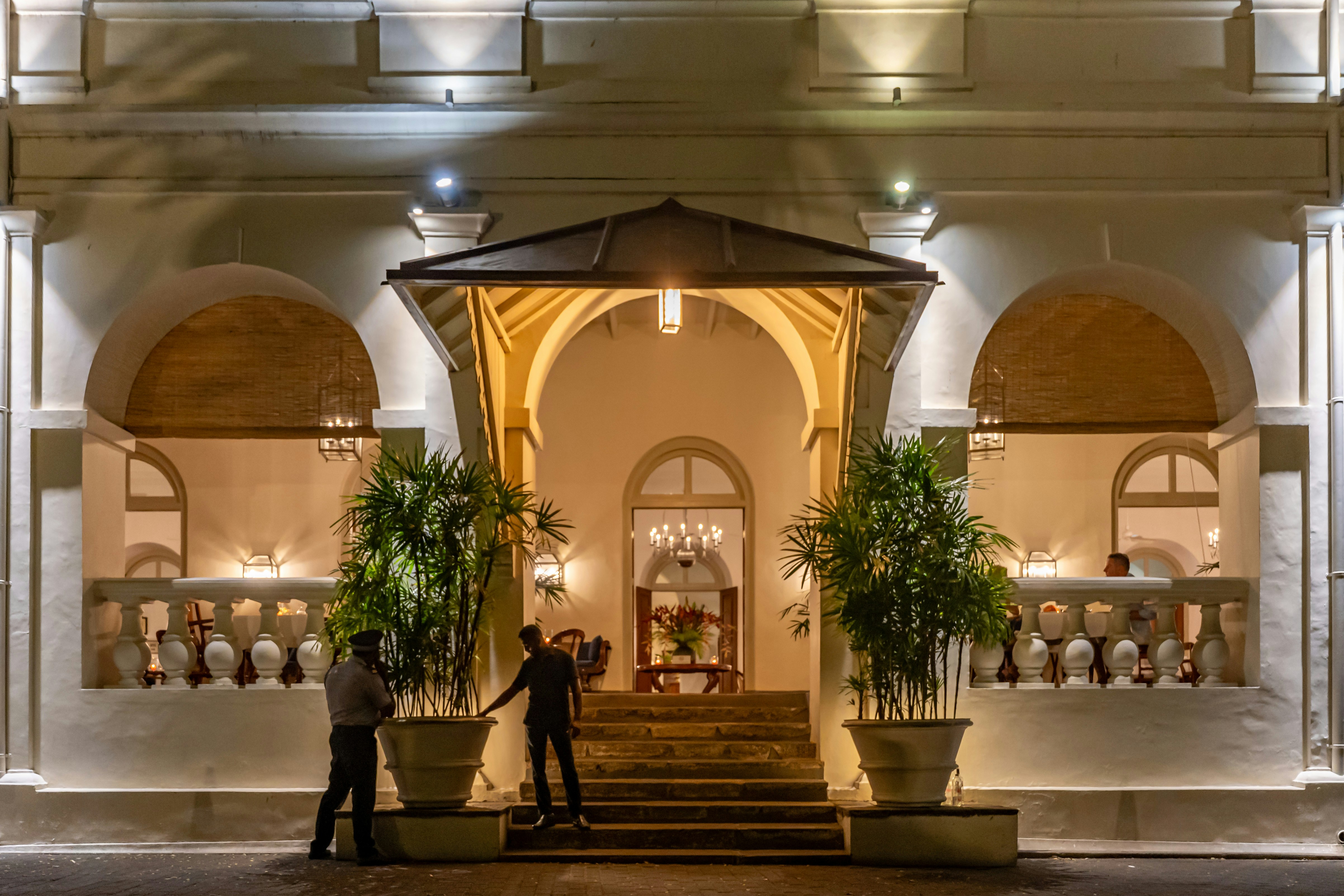 Lit Archway at Night: Quiet Entrance to a Courtyard Sanctuary