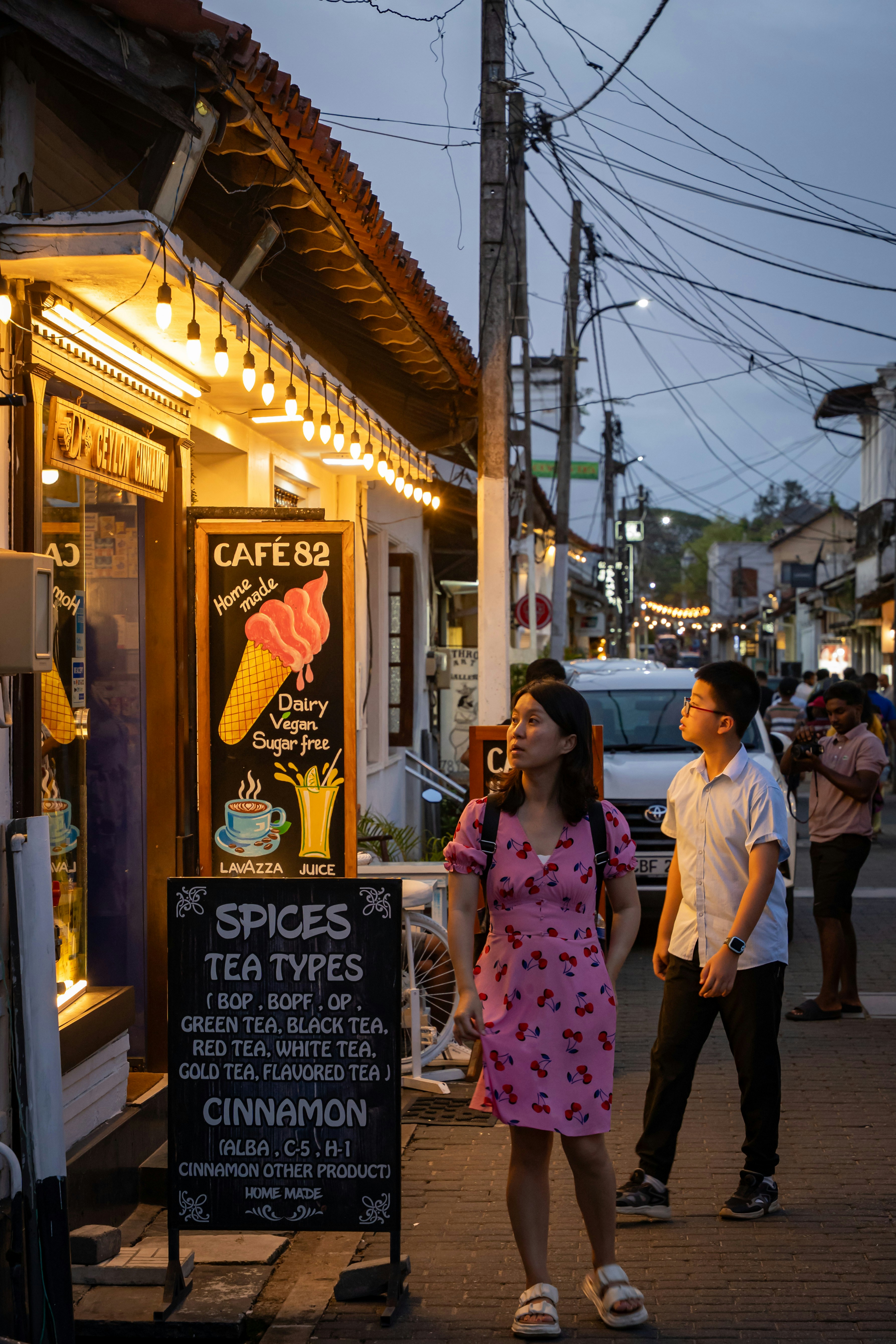 Night Market Promenade: A Couple Delves into Warm Lights and Street Flavors