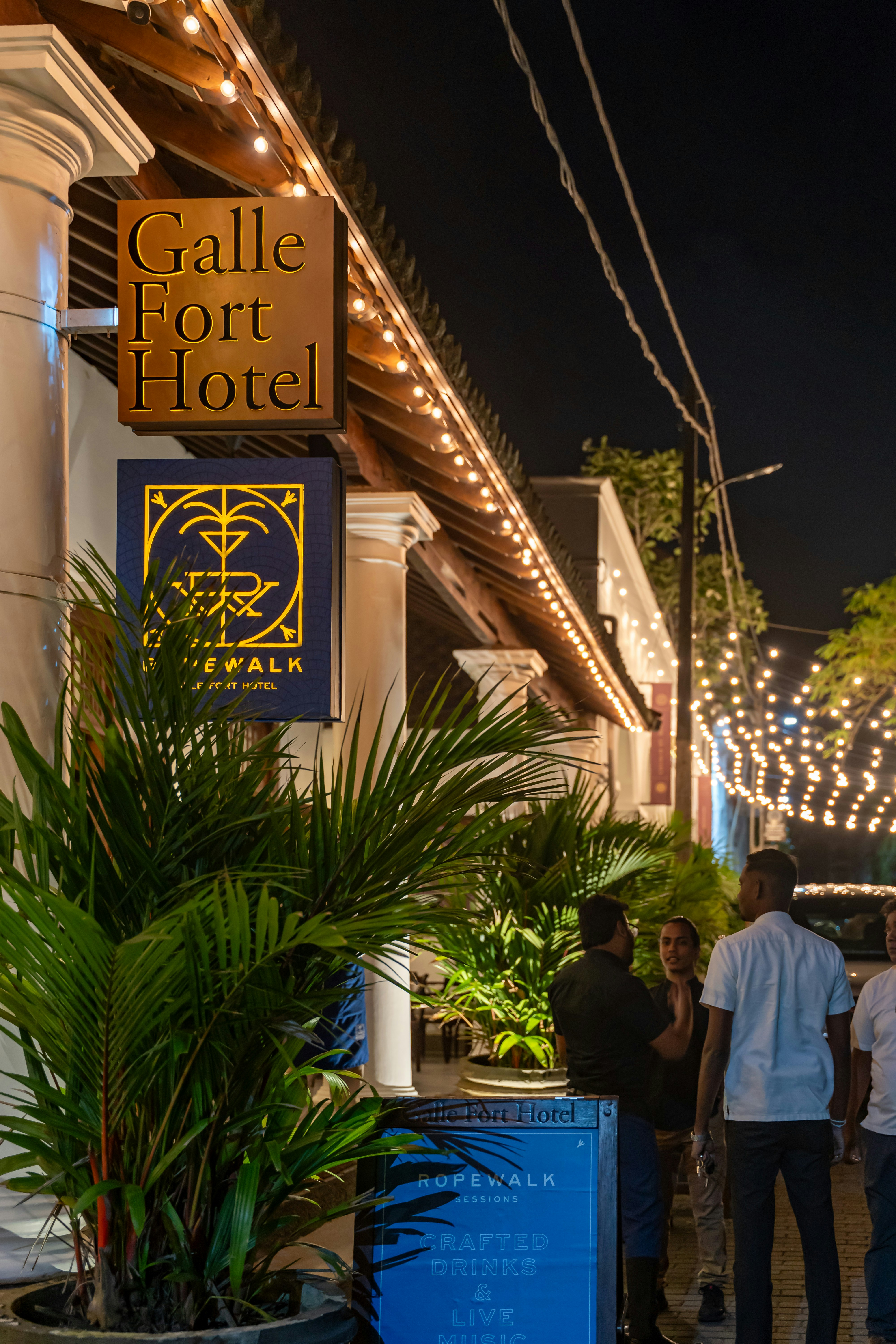 Nightlife at Galle Fort Hotel: Lanterns, Signage, and Social Silhouettes