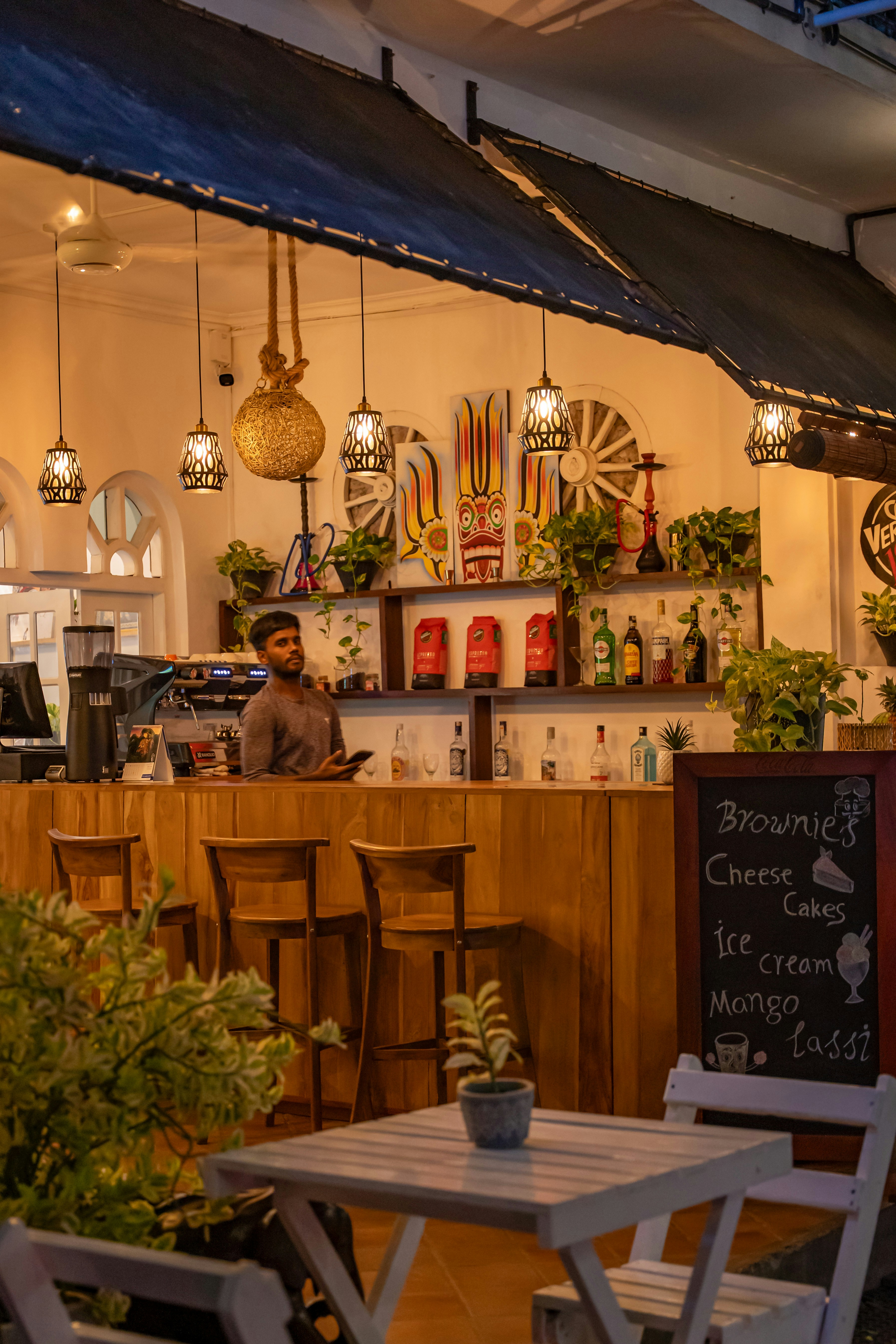 Warm Ambient Bar at Dusk: A Lounge Scene with Bar Counter and Chalkboard Menu