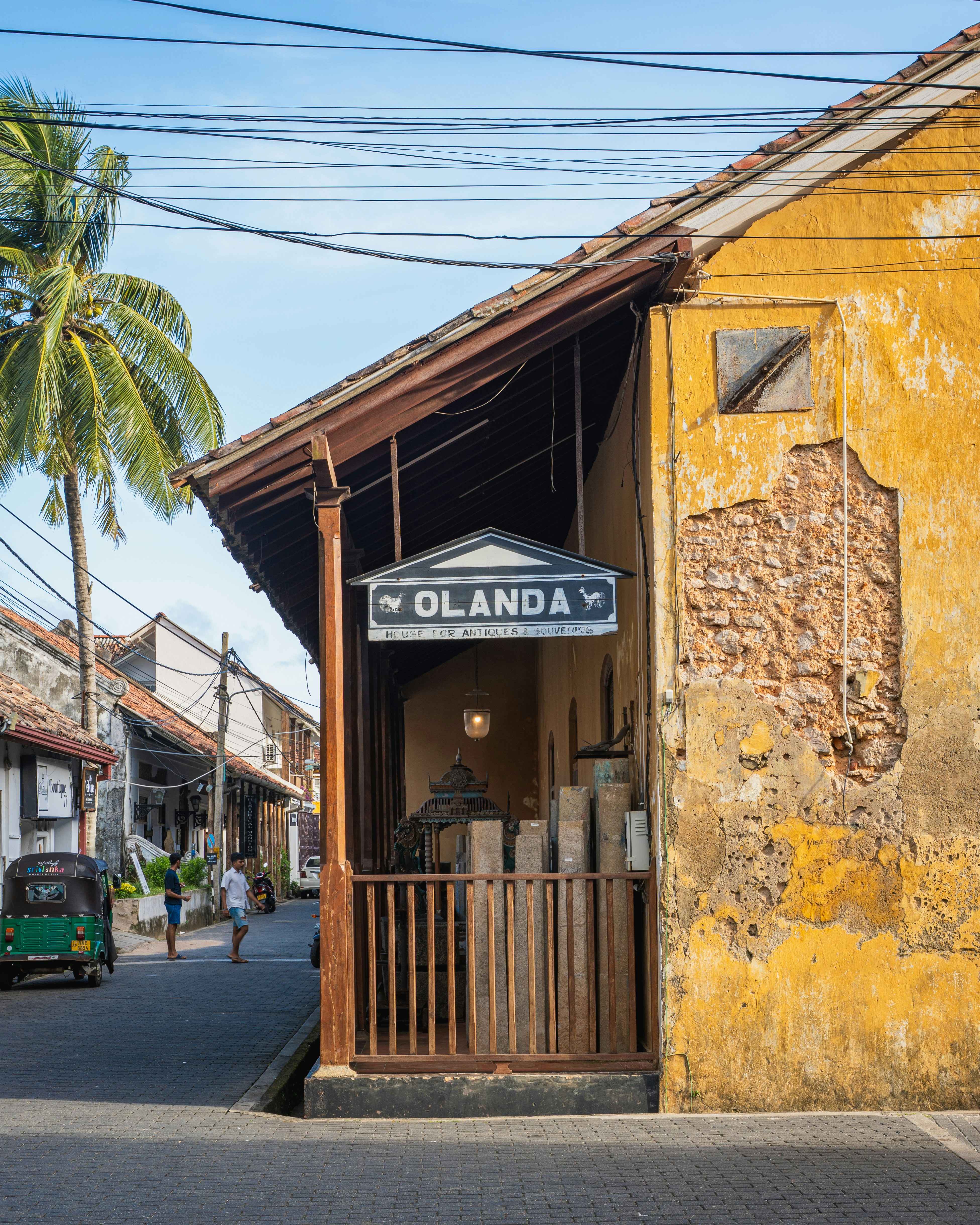 Olanda Storefront in Sunlit Colonial Street