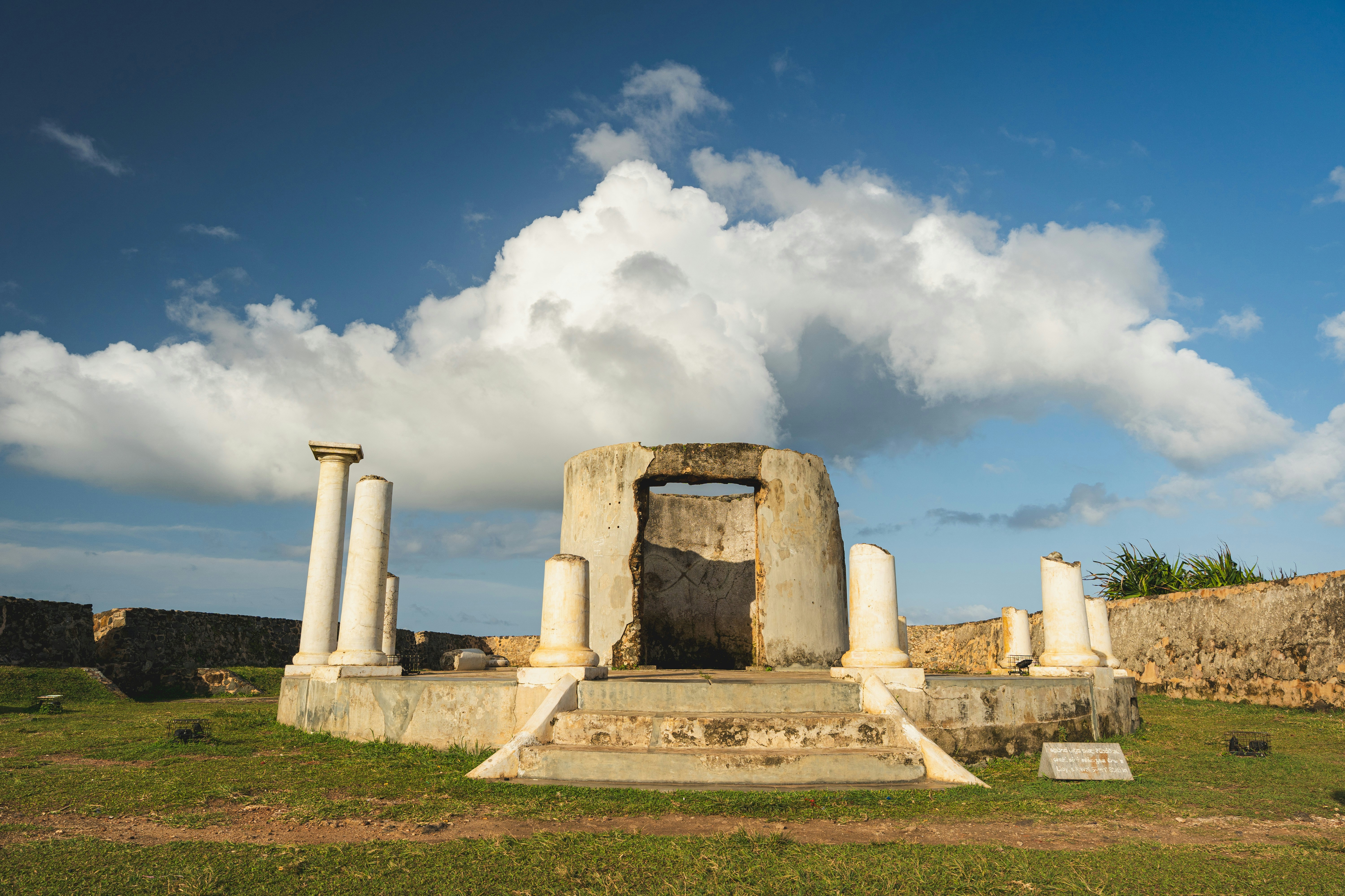 Stone Portal in a Sunlit Ruin Under Expansive Sky