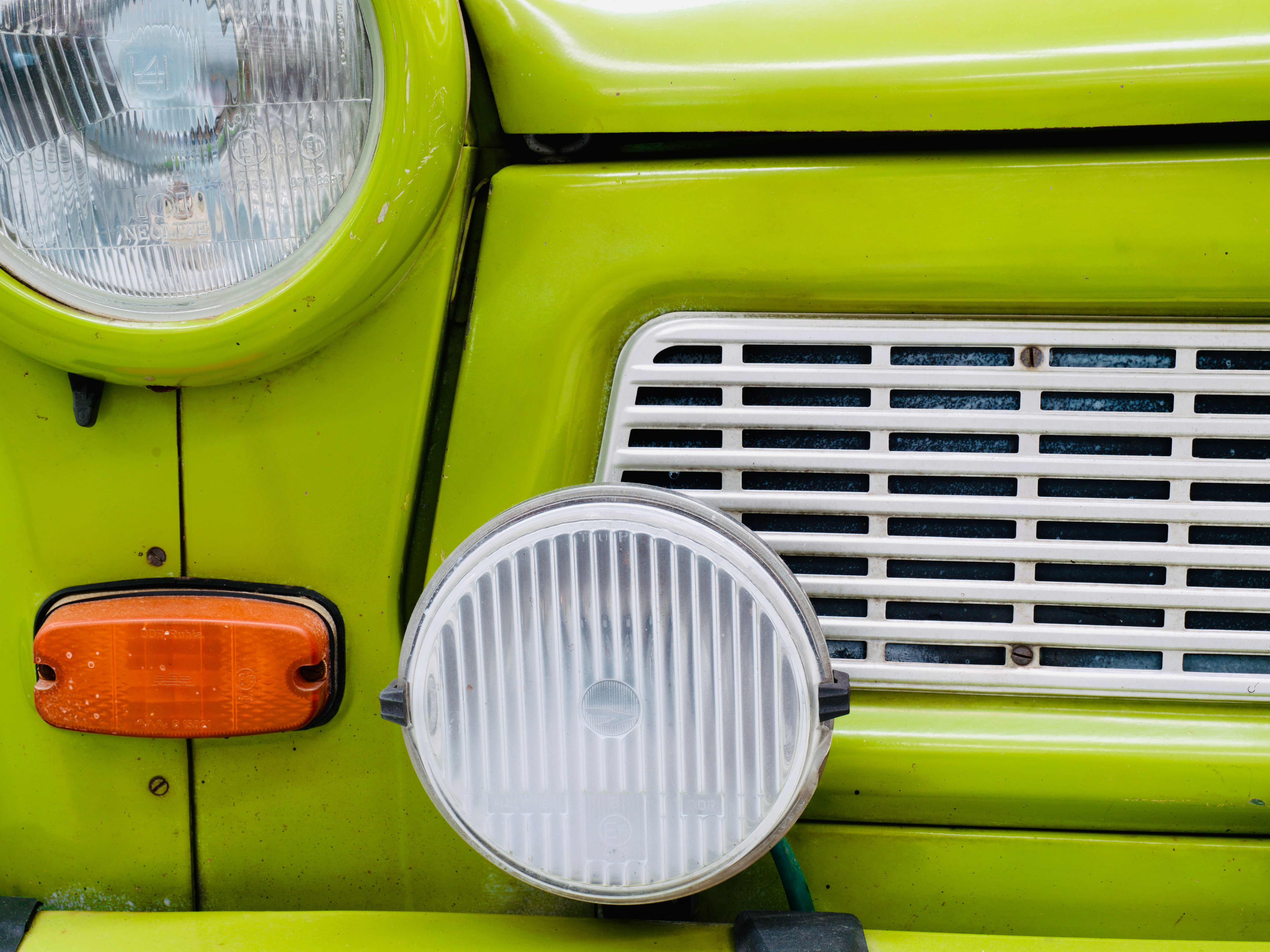 Neon Green Vintage Grill: Focus on the Round Headlight