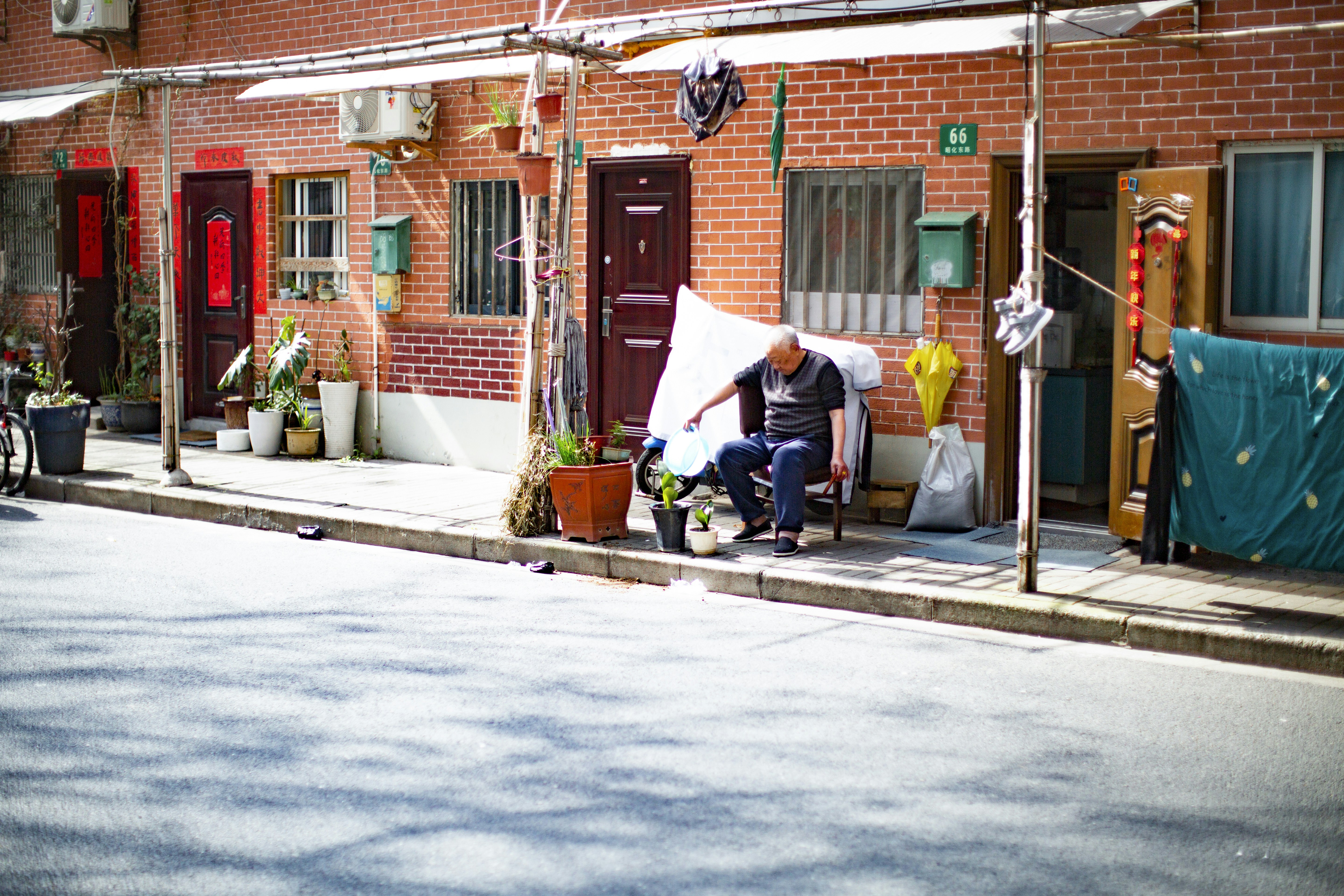 Patchwork Quiet: A City Block’s Solitary Moment on the Front Step