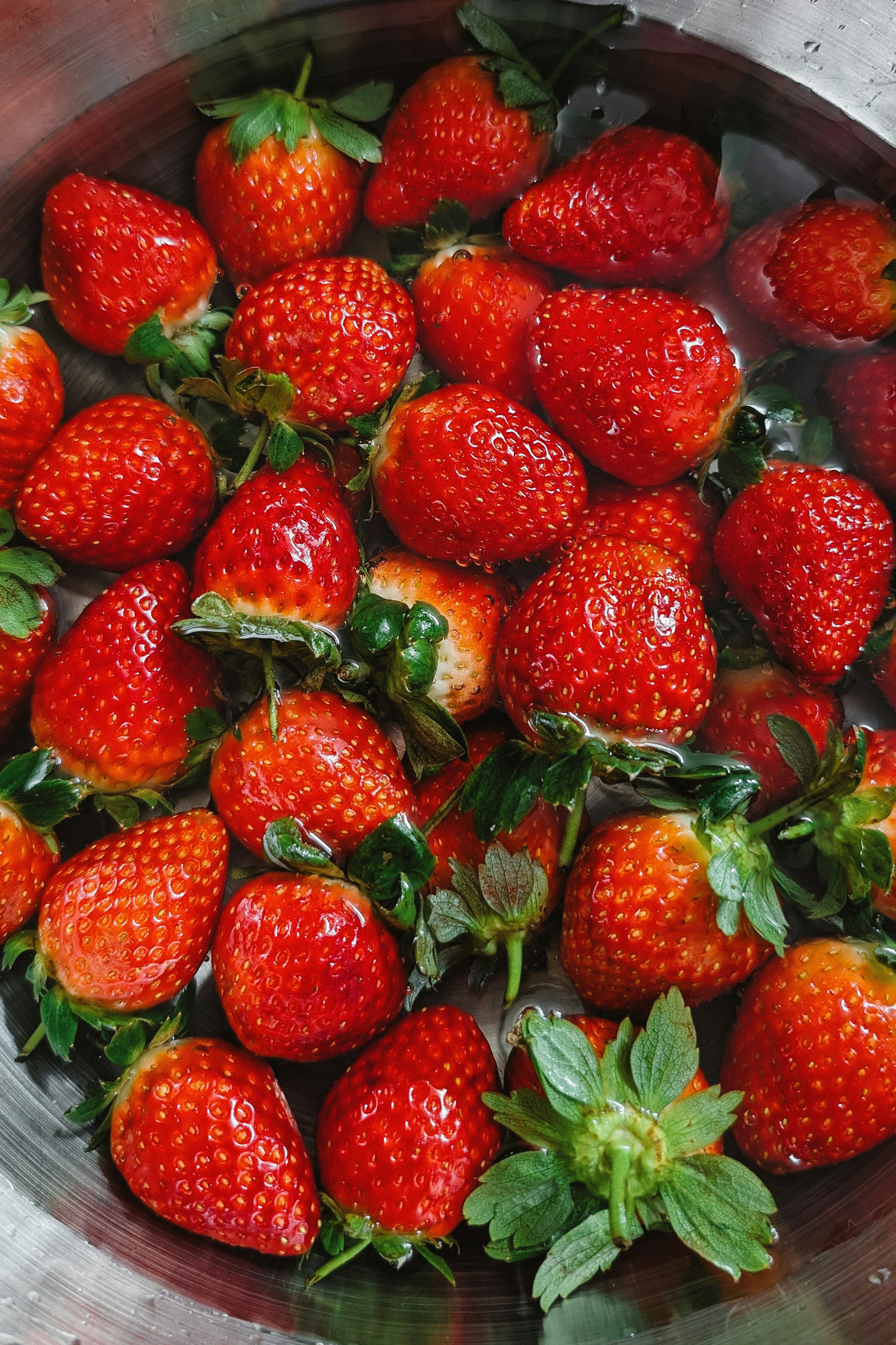 Juicy Red Harvest: Strawberry Cluster in a Shiny Bowl