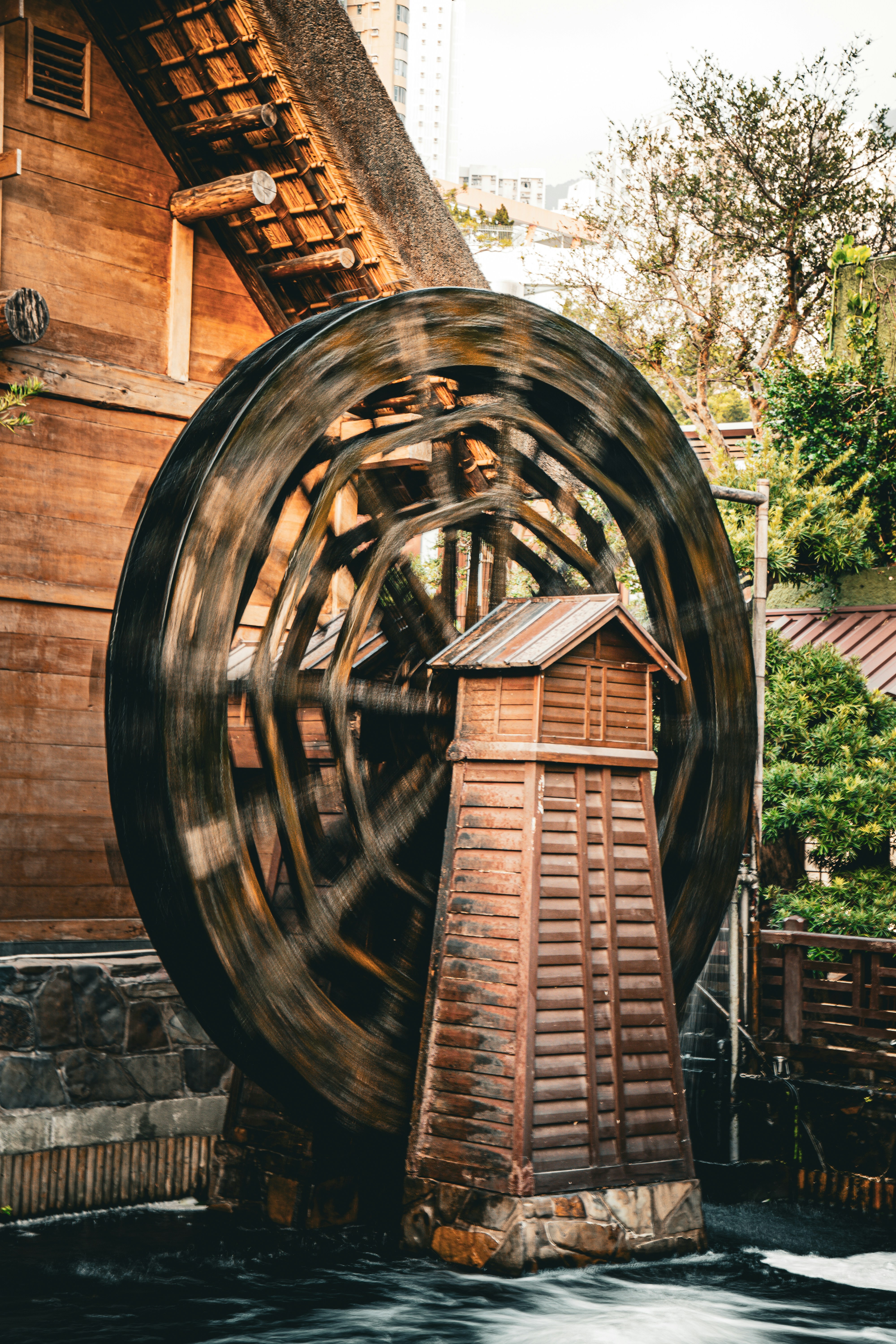 Time-Woven Wheel: A Wooden Watermill in Motion