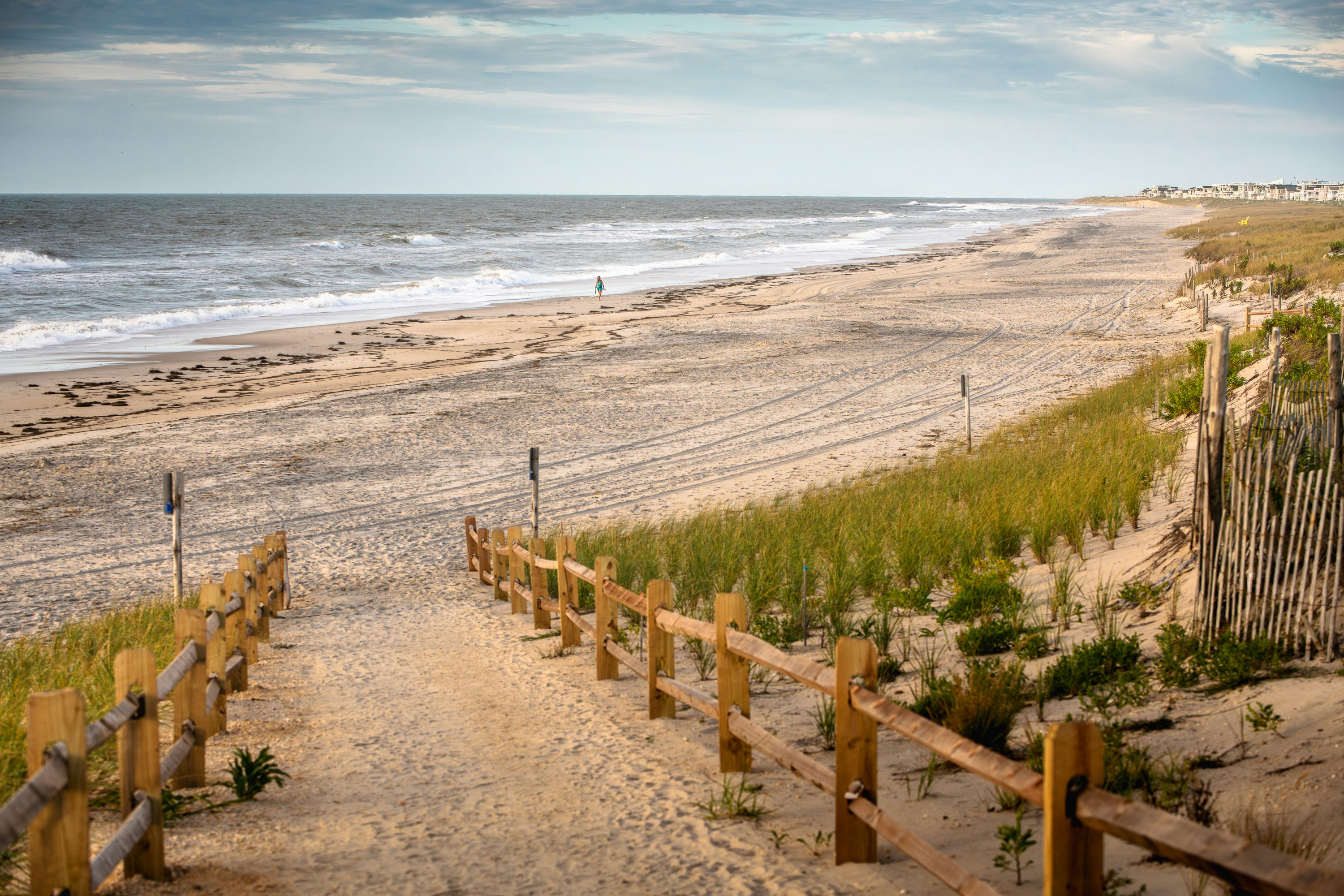 Wooden Trail to the Shore: A Quiet Path Through dune grass