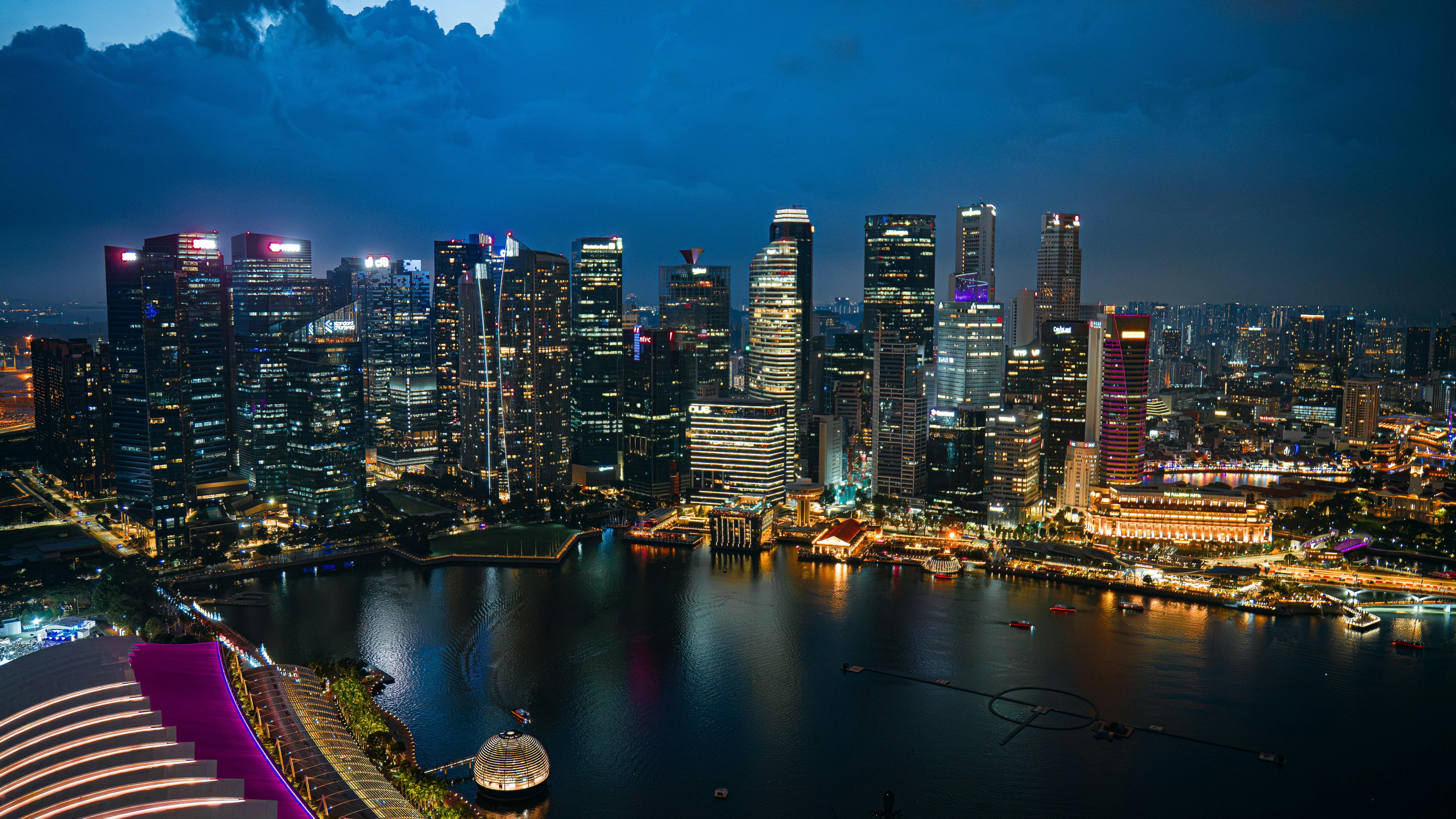 Nightfall Over Marina Bay: Skyline Reflections from the Promenade