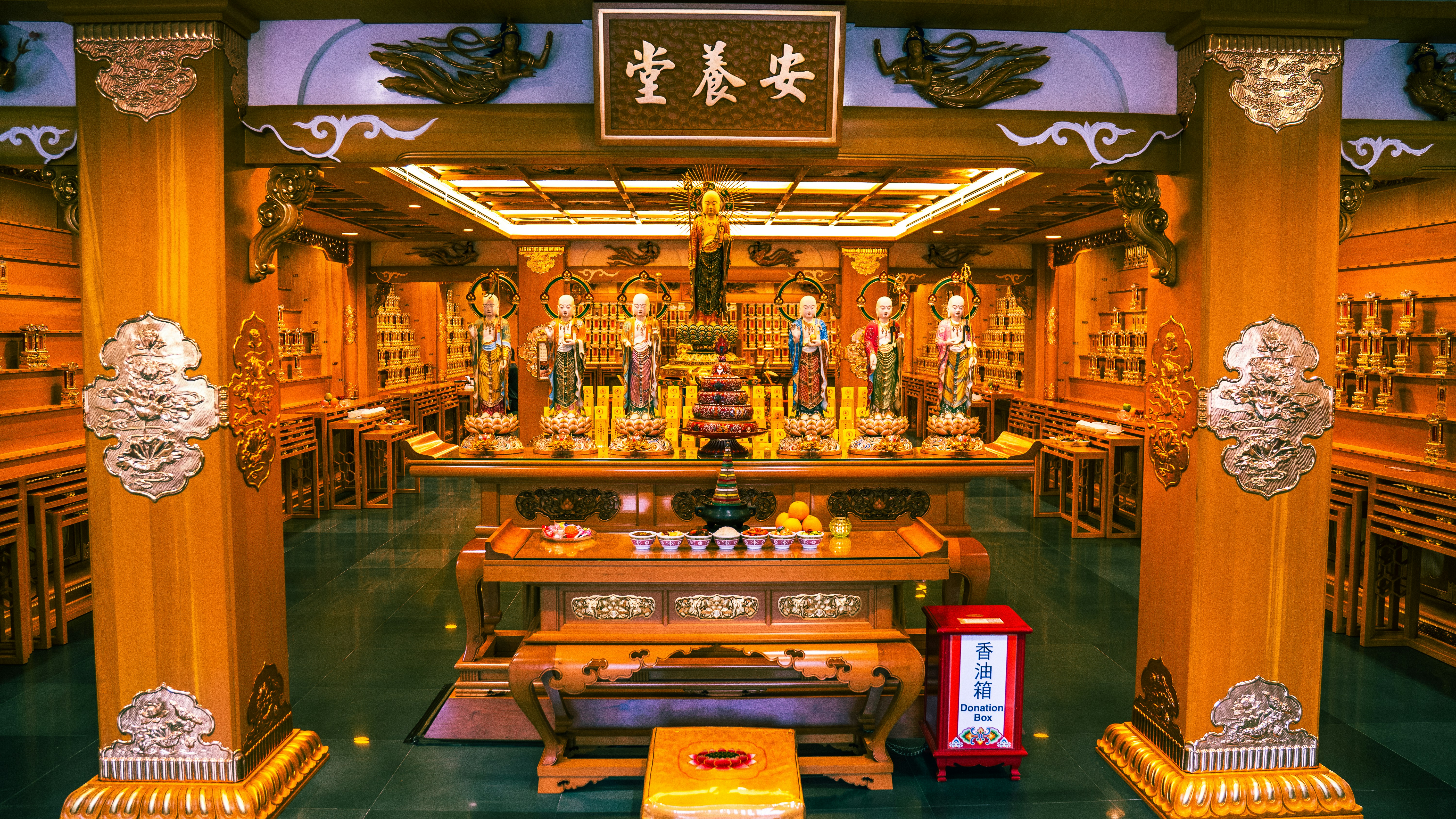 Sacred Censer Hall: Rows of Statues and Altar Beneath Ornate Carpentry