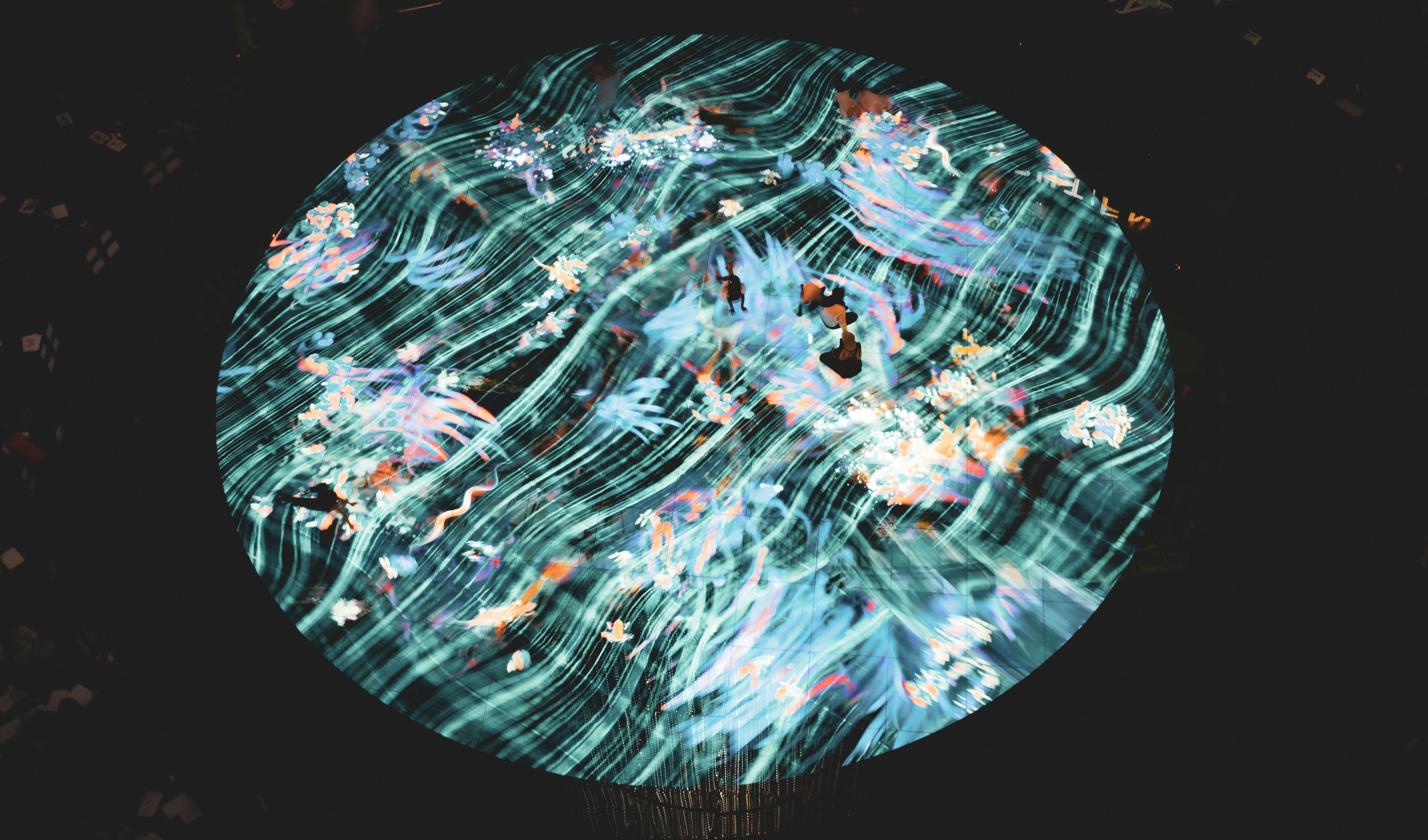 Blue-spiraled aquarium light: swirling glow within a circular canvas
