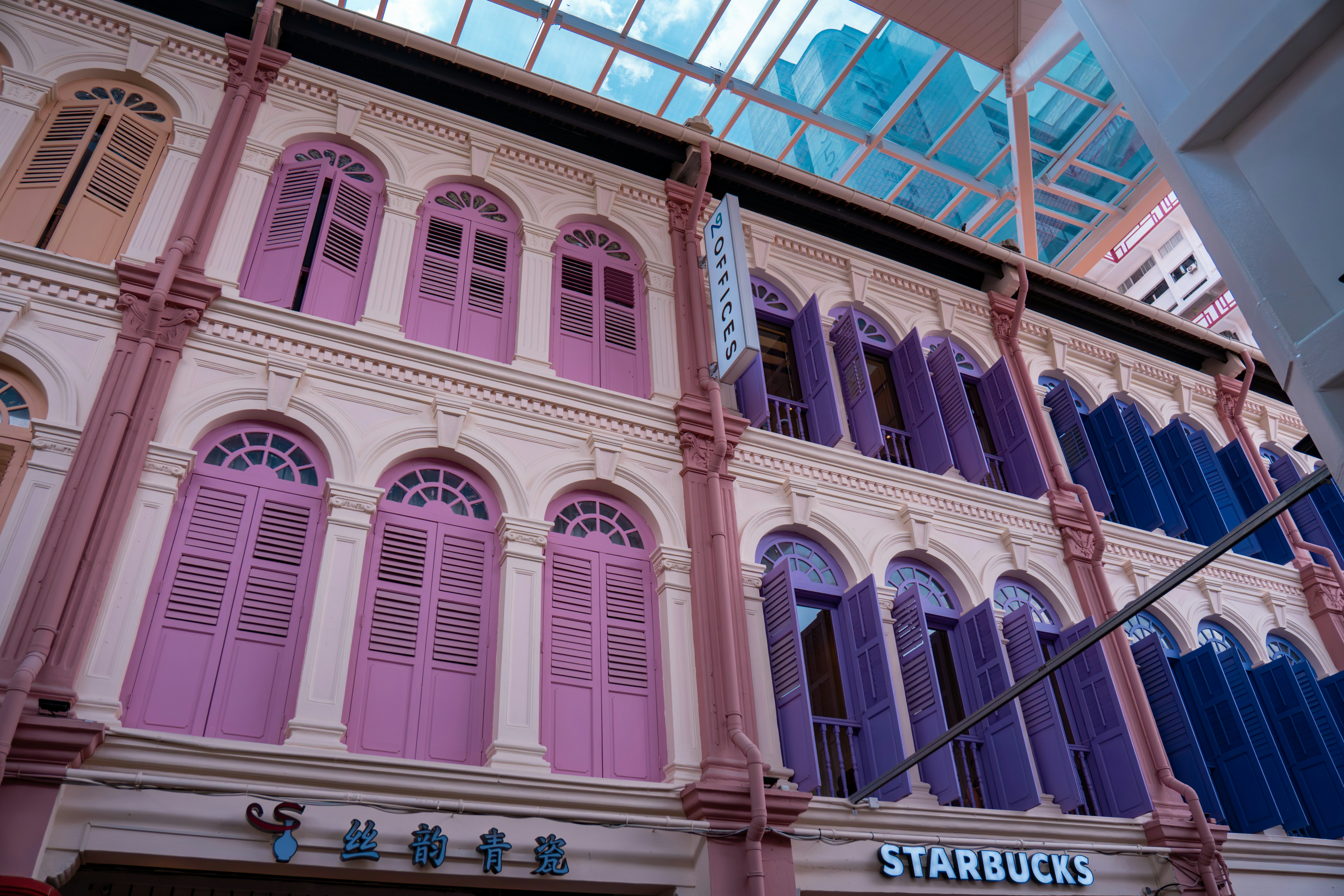 Pastel Arcades: A Colorful Facade of Shuttered Shops