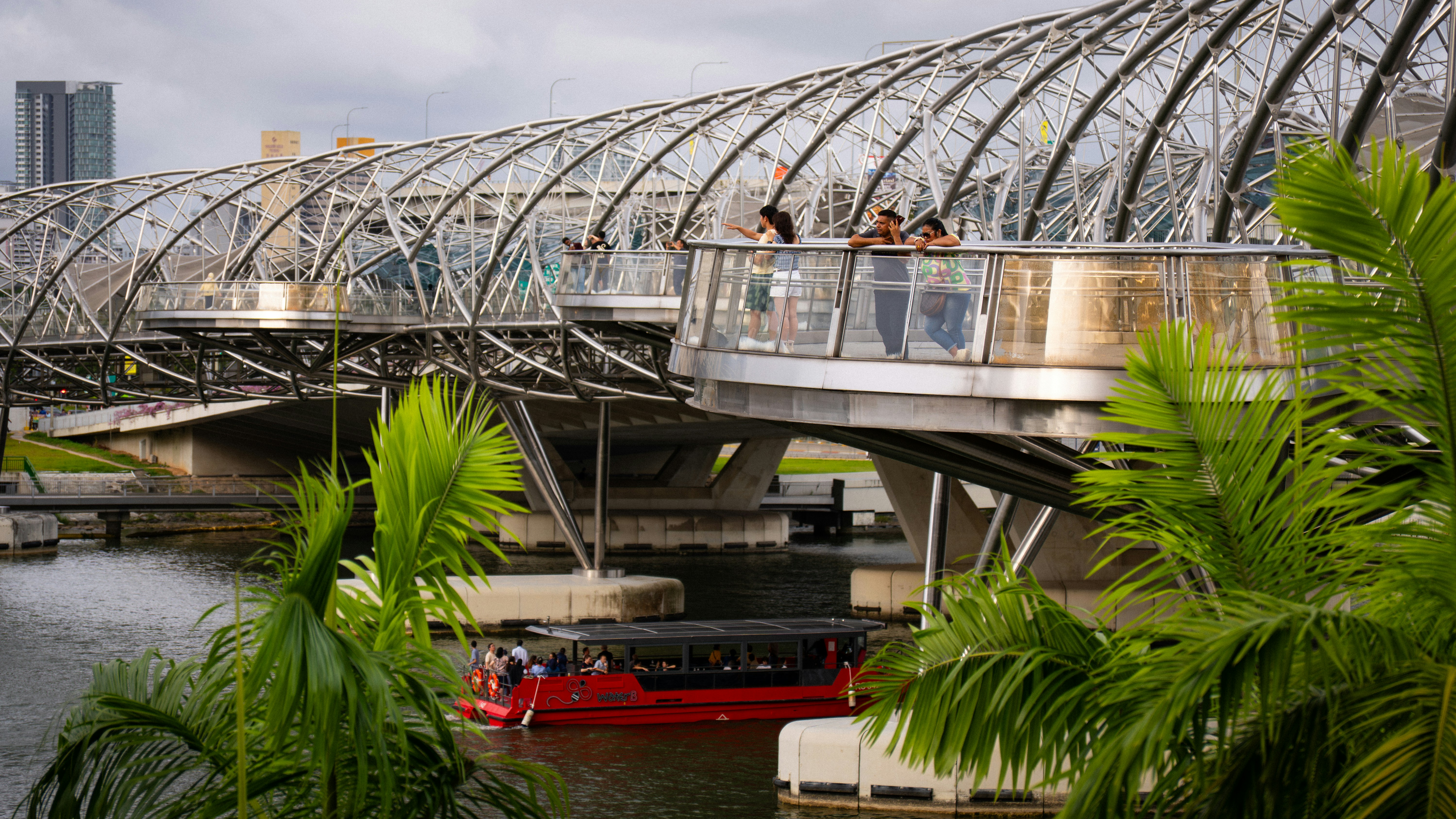 Curved Glass Walkway Framing a City Boat Ride