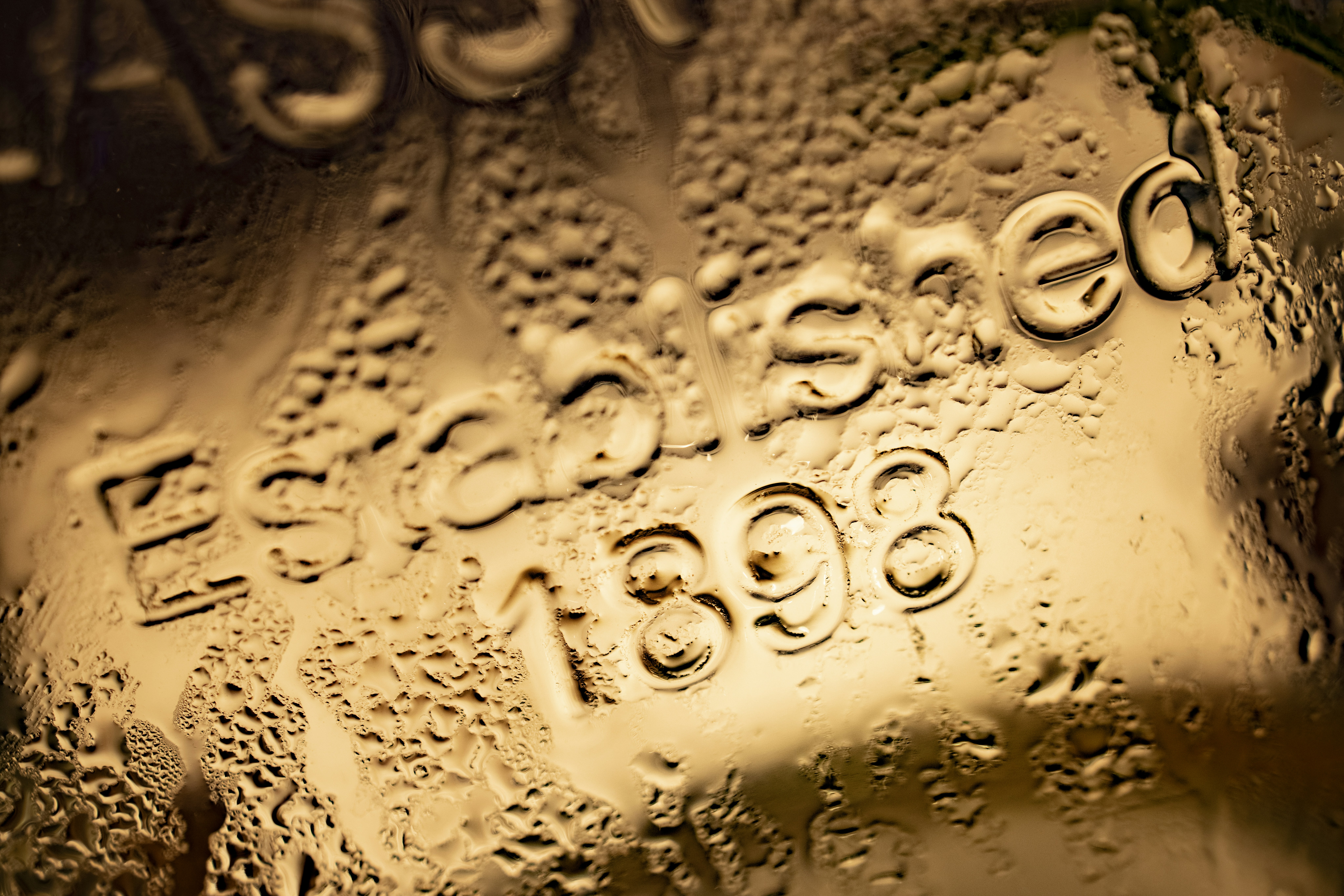 Glowing Stamp of Time: Close-Up of a Misty Gold Etching