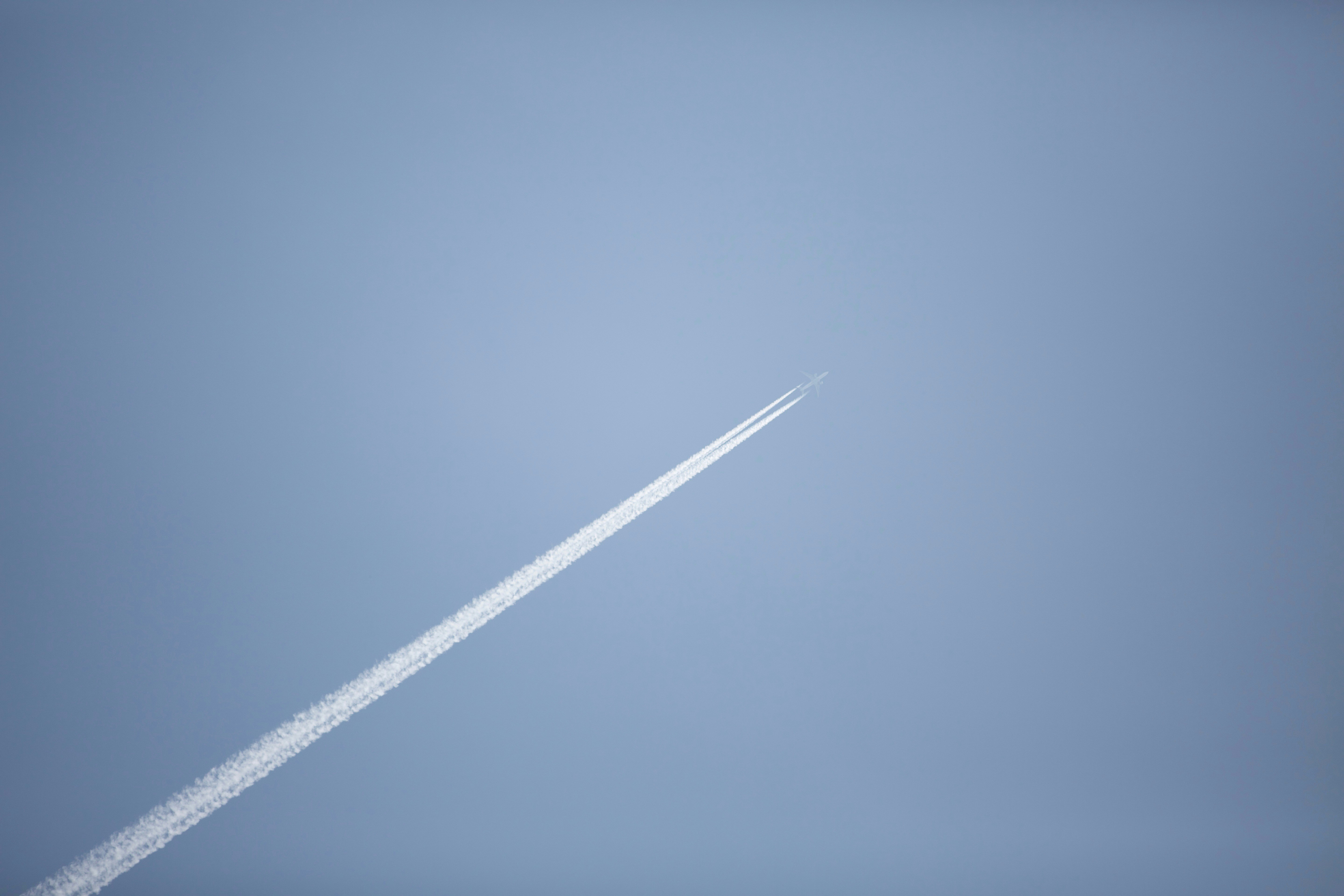 Contrail Arc Across a Clear Winter Sky