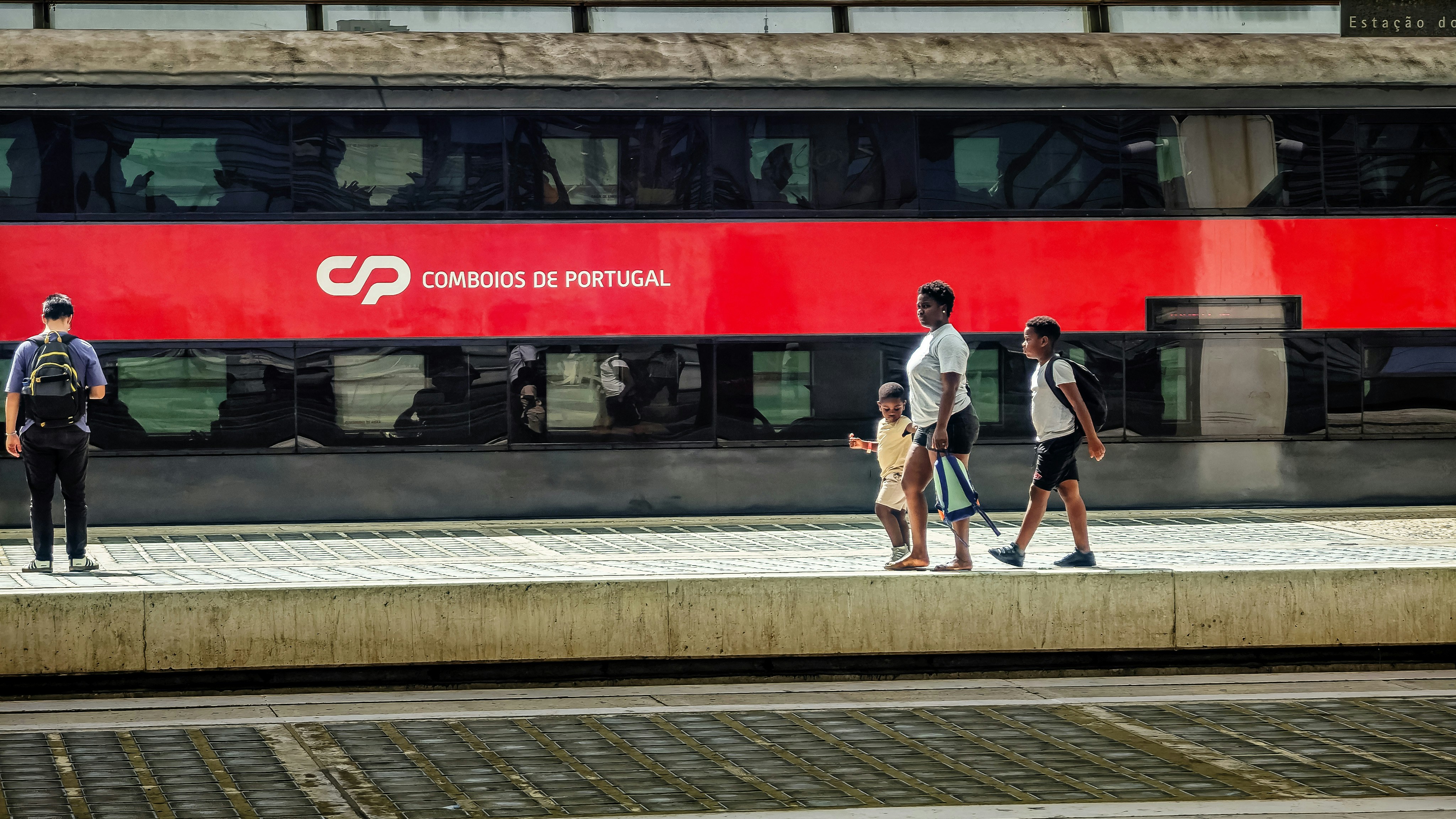 Red Rails, Quiet Crossing: A Family Walk Past the Commuter Train
