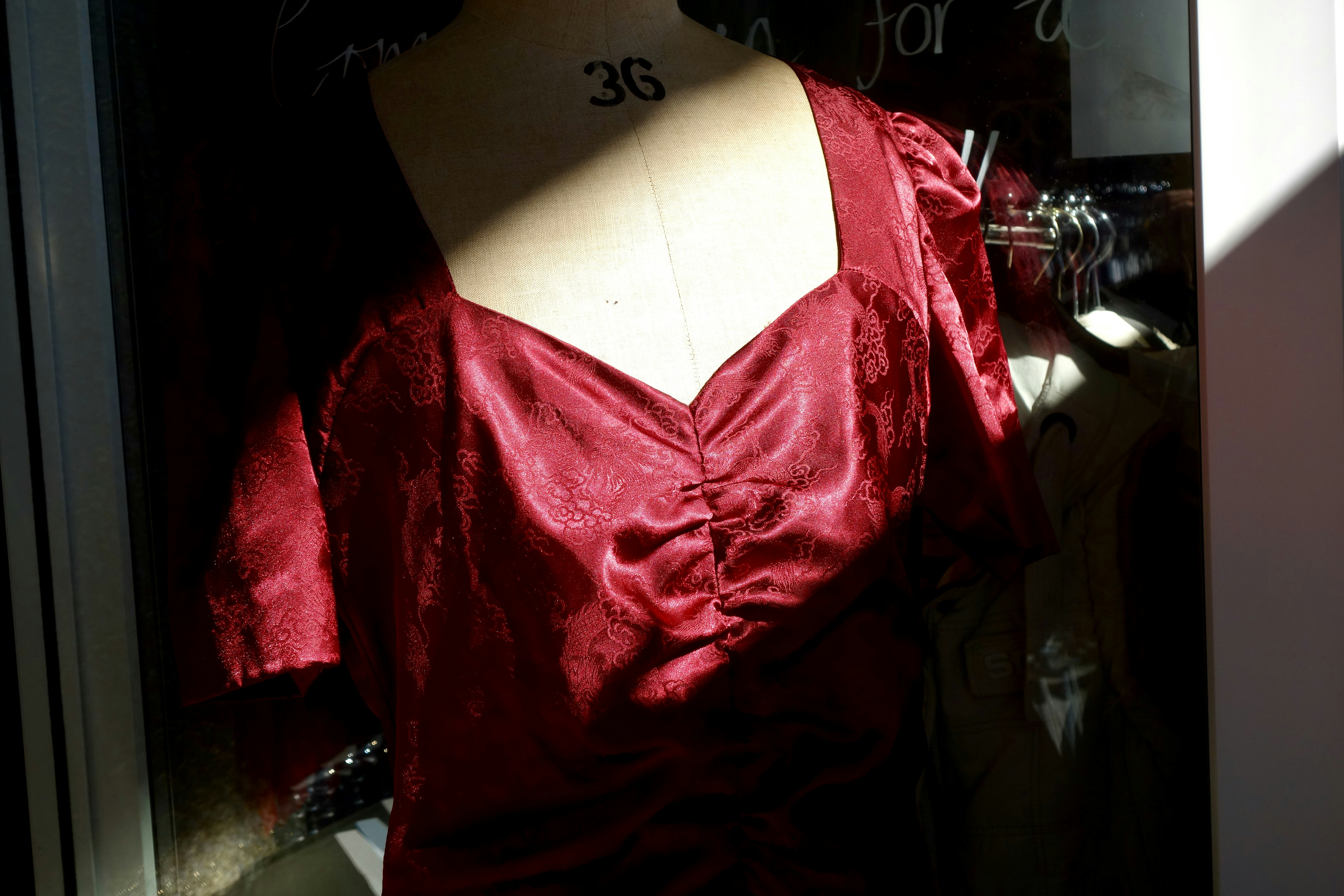 Crimson Dress in a Storefront Portrait