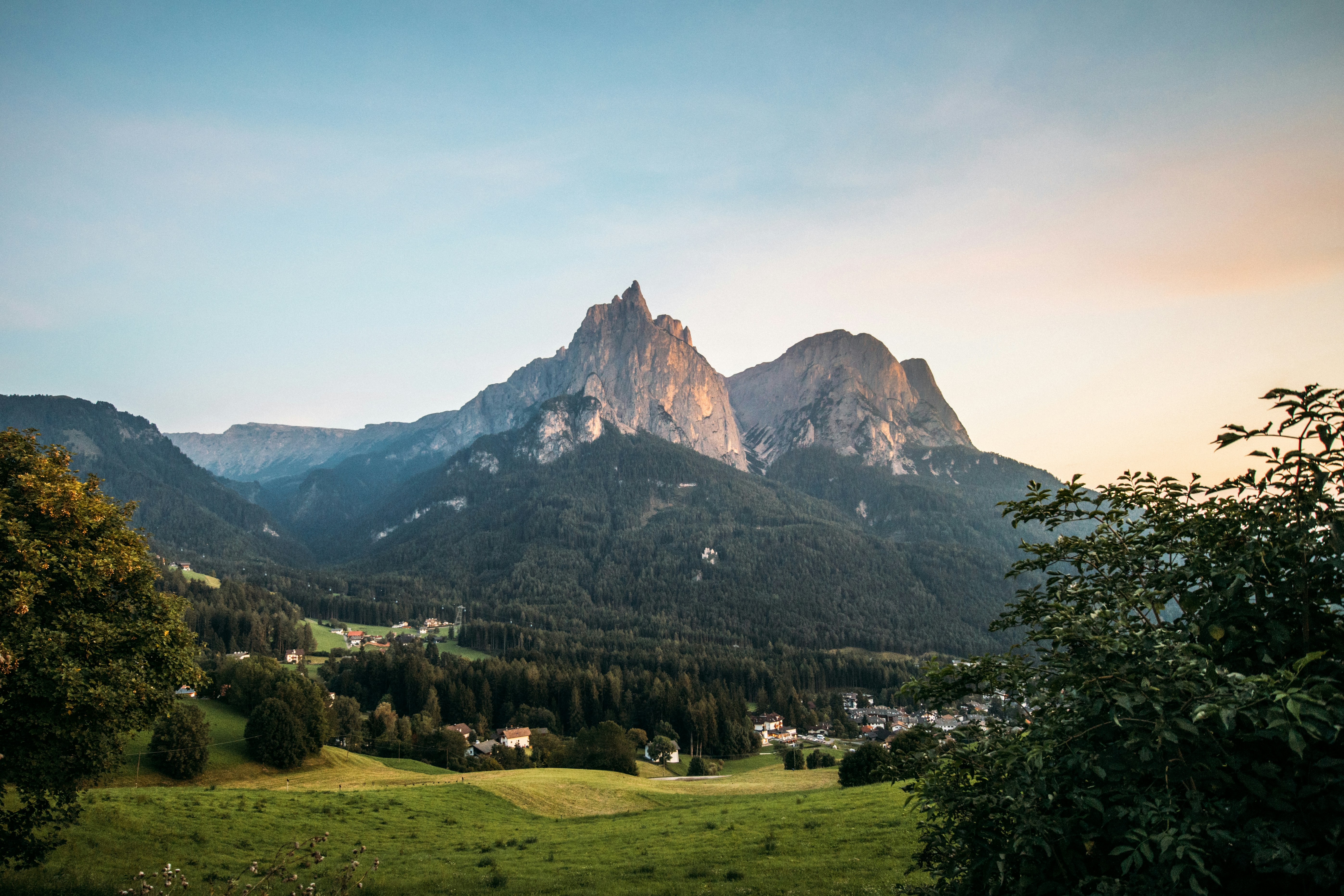 Emerald Valley Gateway: Peaks Casting Long Shadows Over a Quiet Village