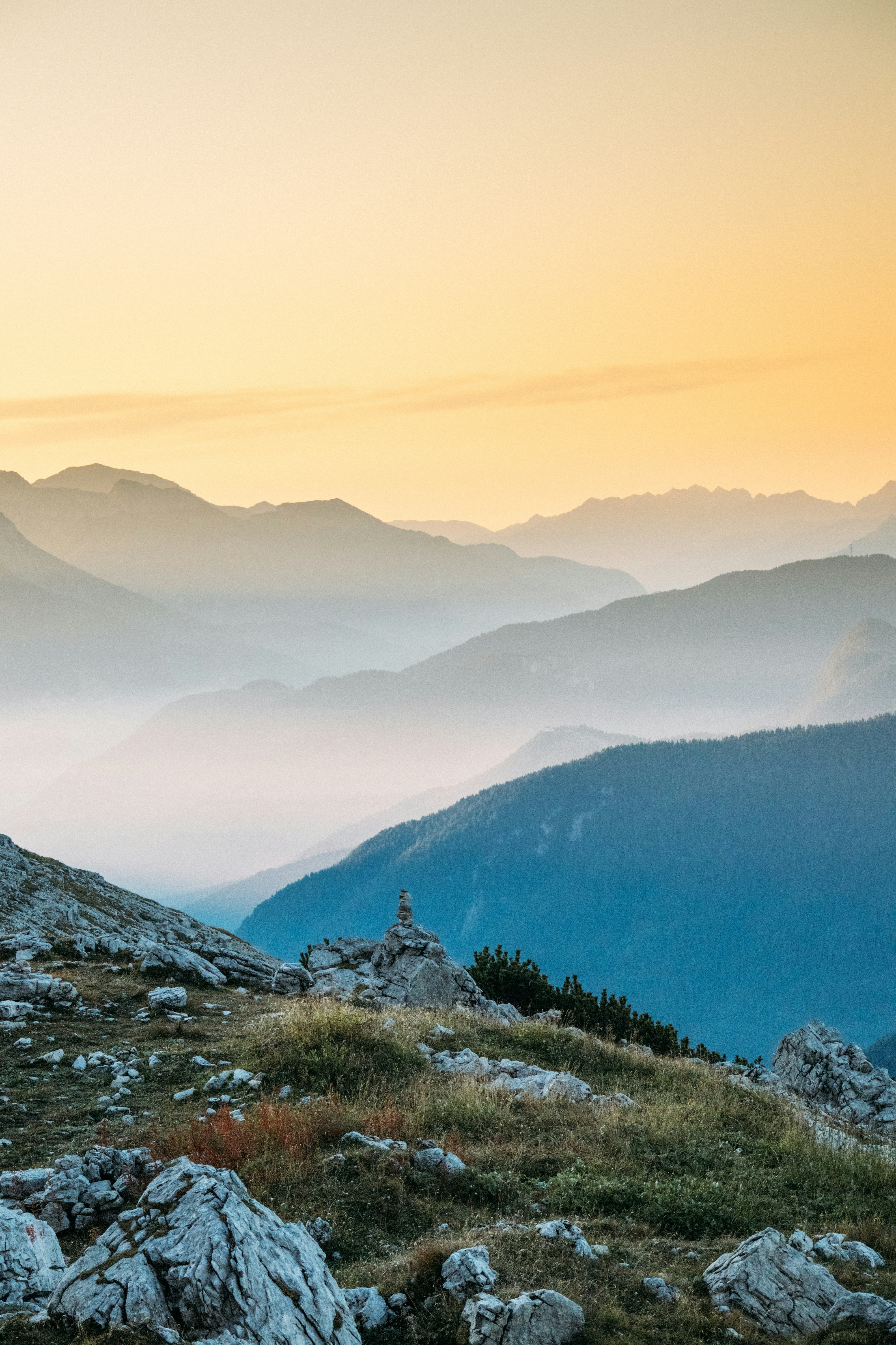 Mist Valley at Sunrise: A Rugged Ridge Rolls Into Soft Light