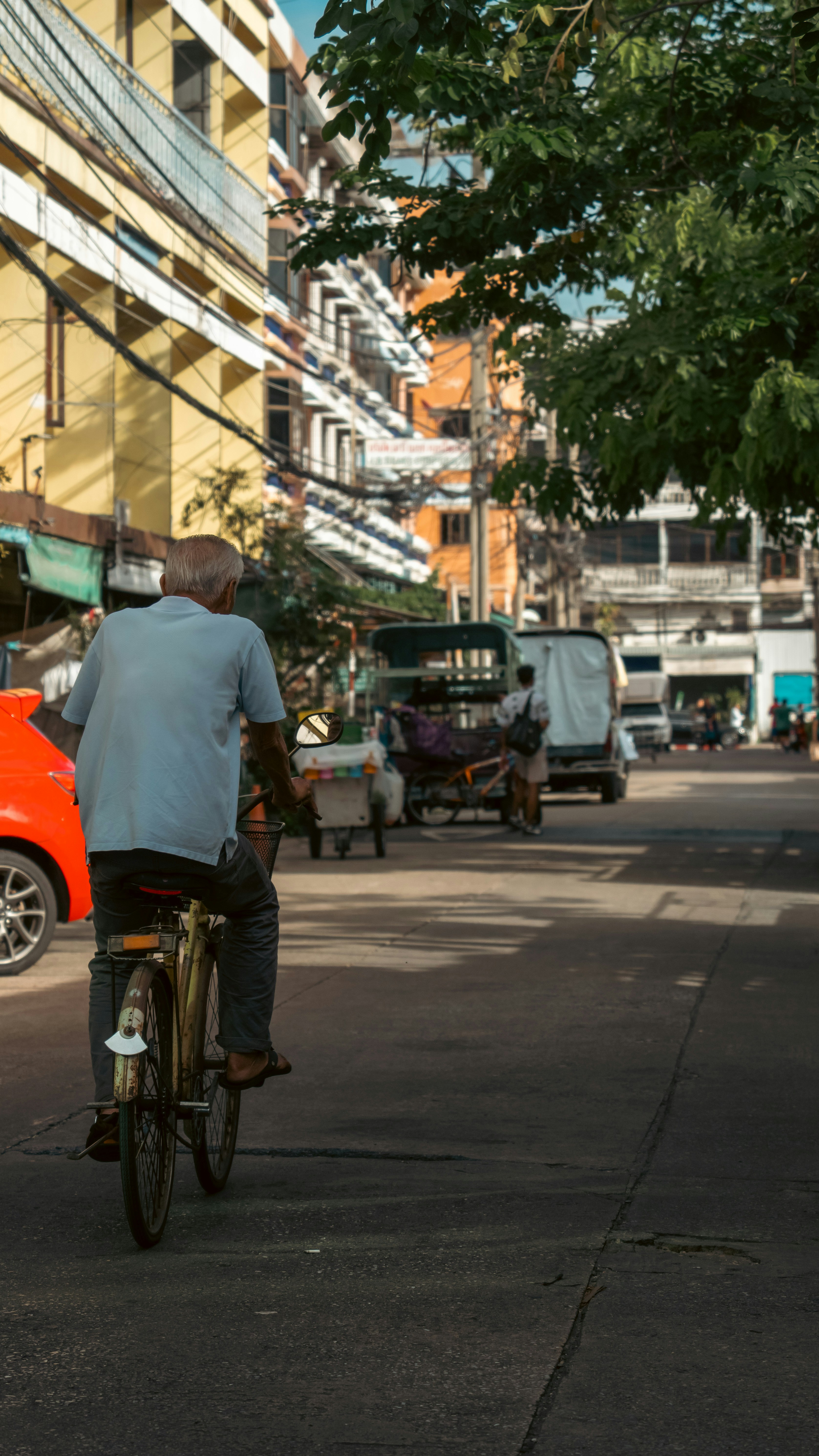 Rider on a Sunlit Urban Corridor