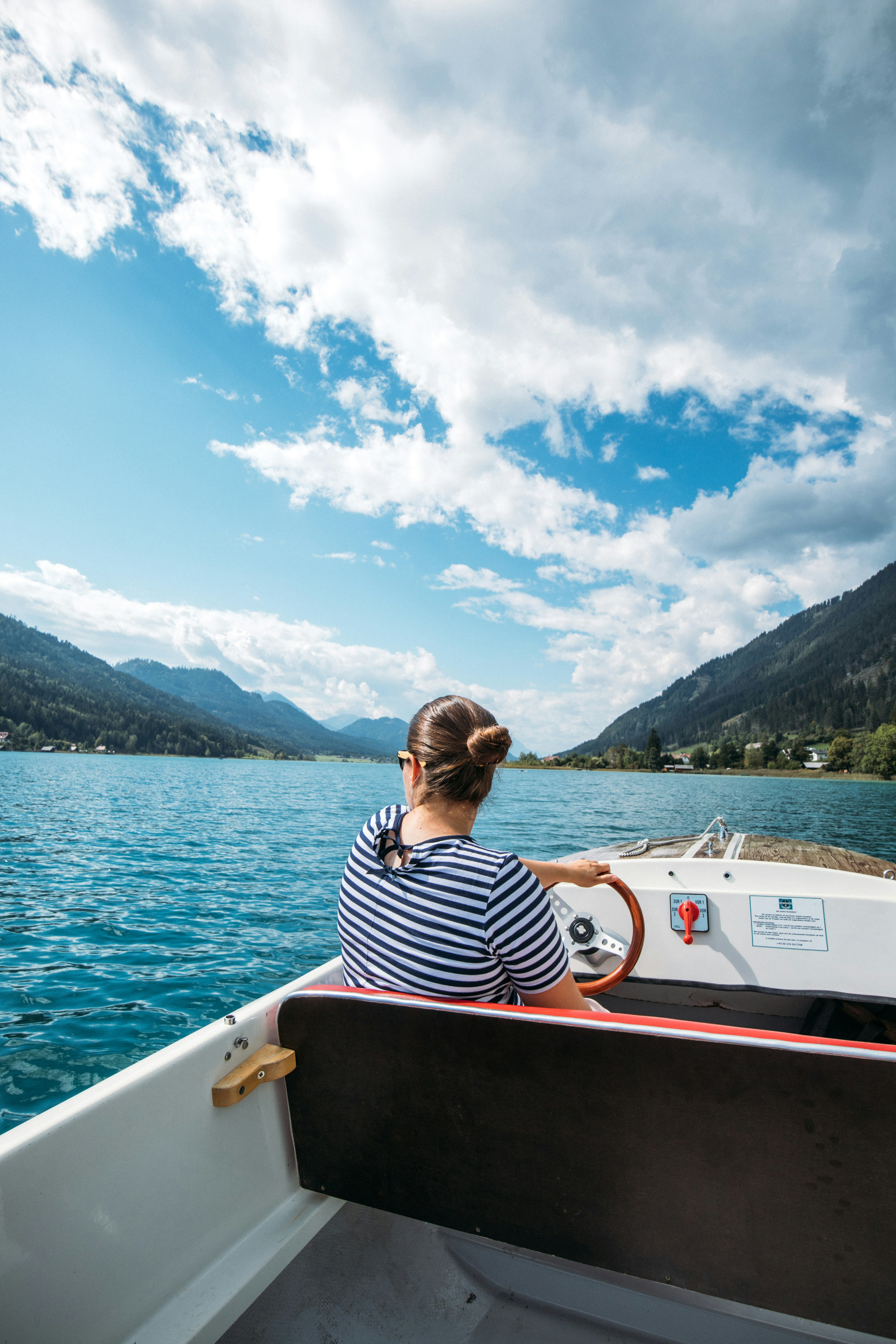 Crewed in Striped Hue: A Sailboat Pilot Evokes Tranquil Alpine Waters