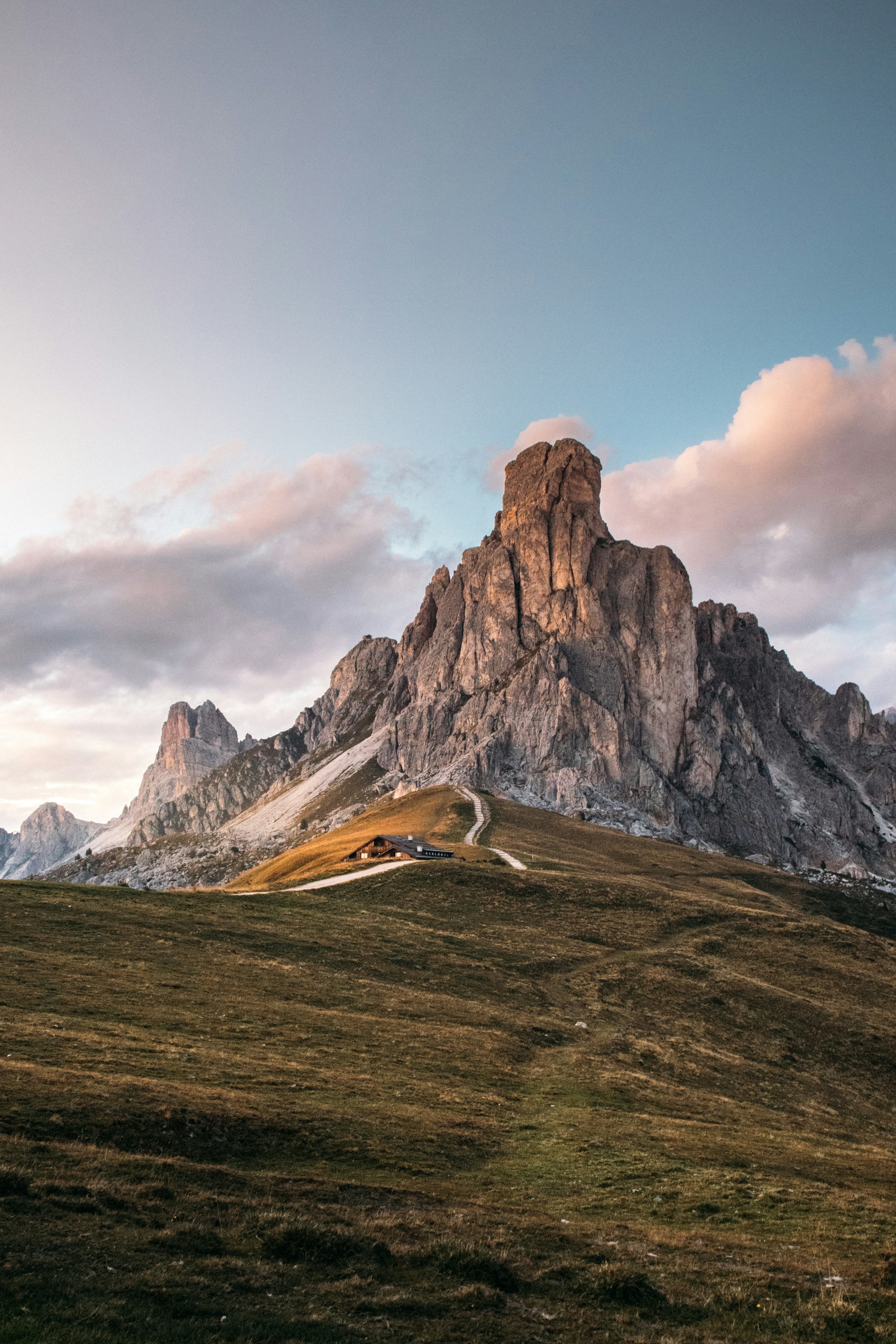 Towering Peak Under Open Sky: A Mountain Pass to the Summit