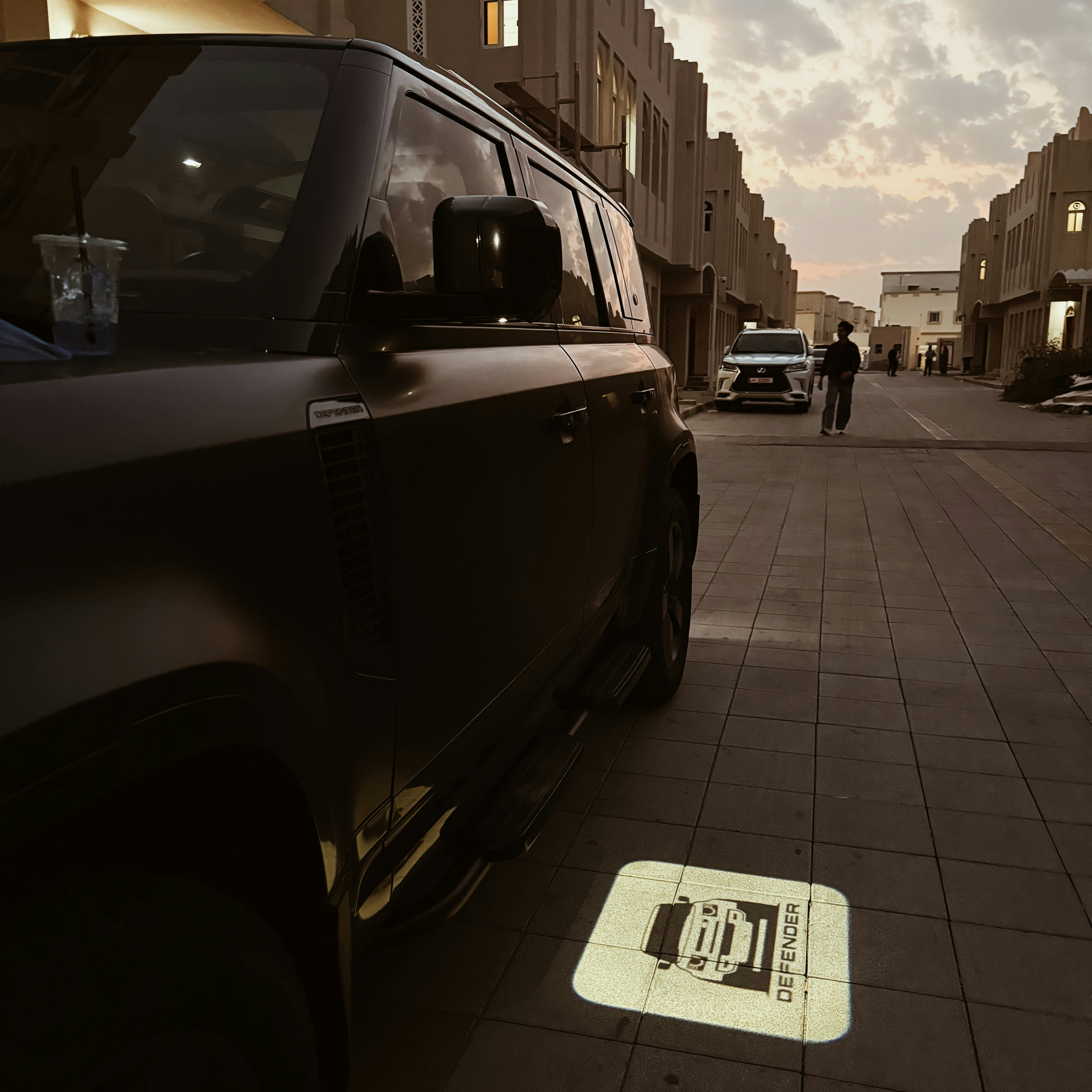SUV in Shadowed Street: Echoes of a Quiet Arrival