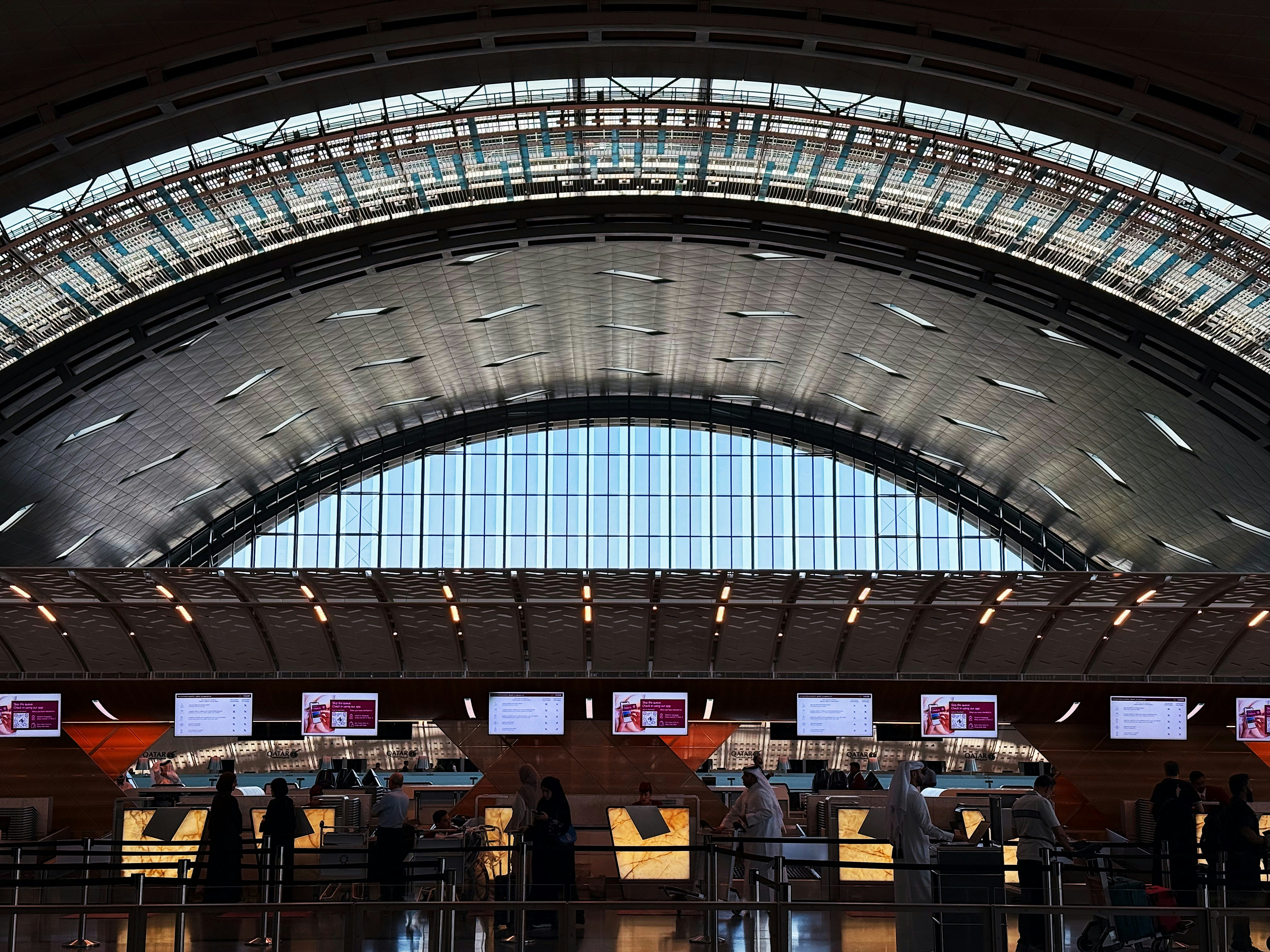 Curved Glass Canopy over a Busy Transit Hall