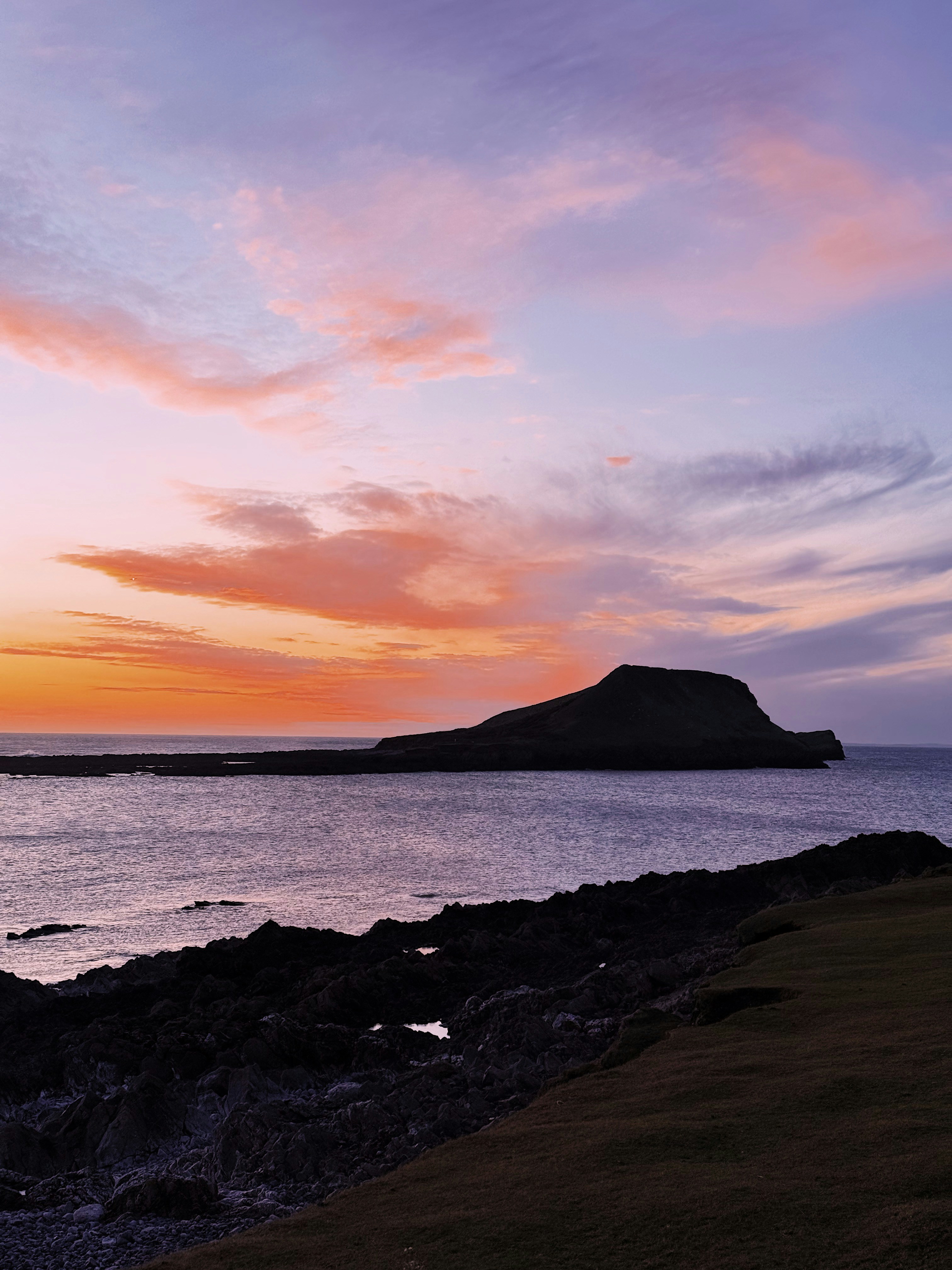 Silhouette Island at Twilight Over Lavender Seas