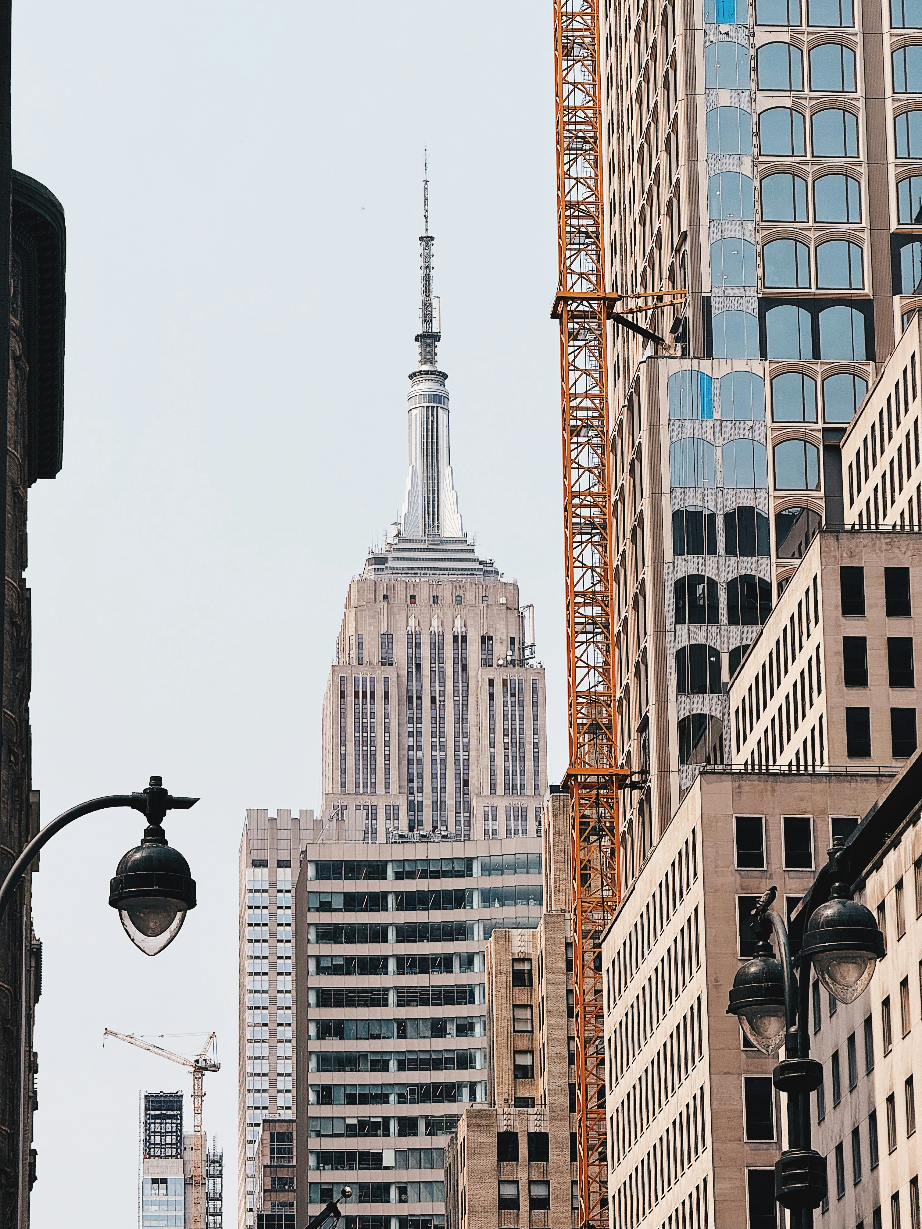 Empire Amid Glass and Crane Steel