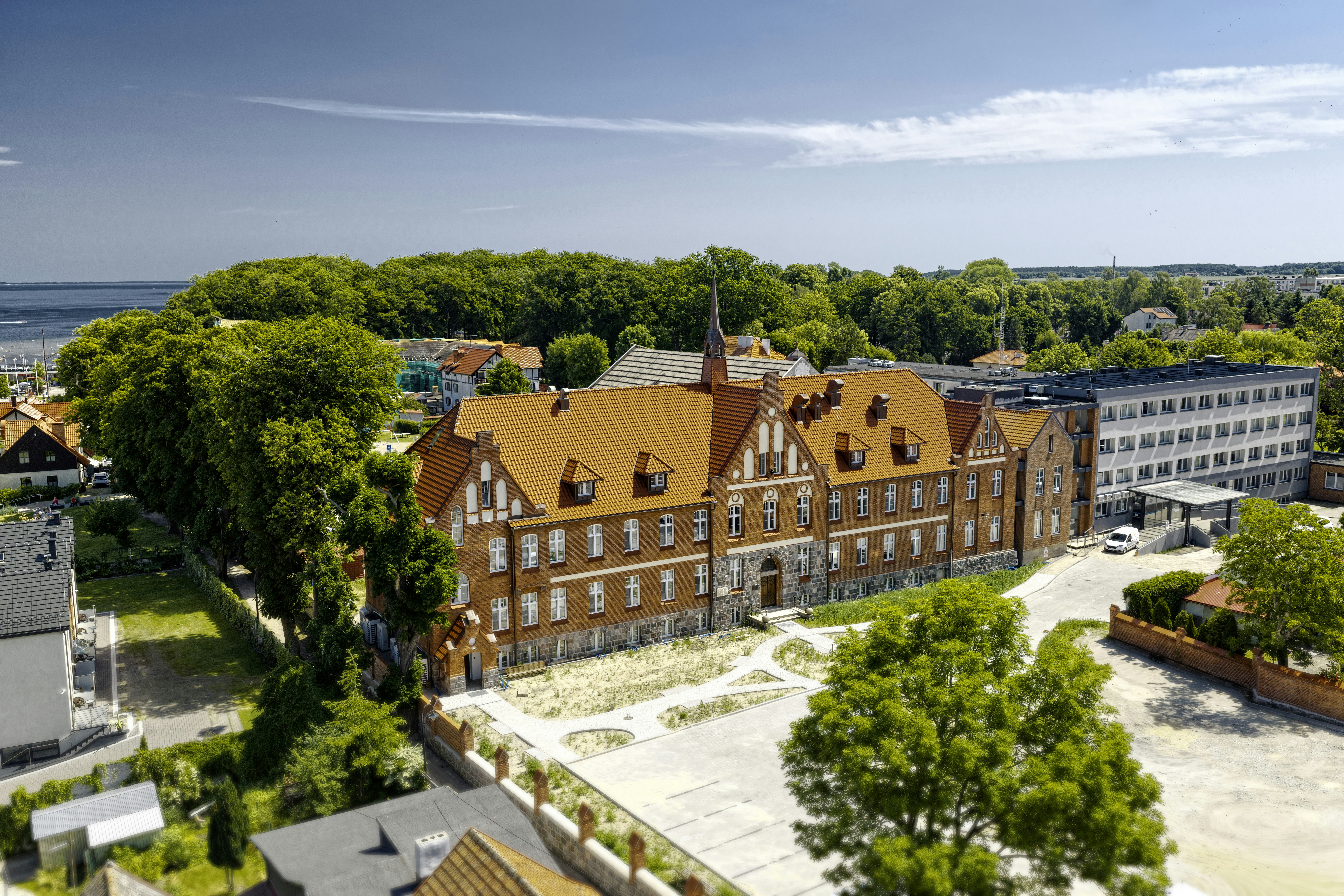 Red Brick Campus Rising from a Riverside Town