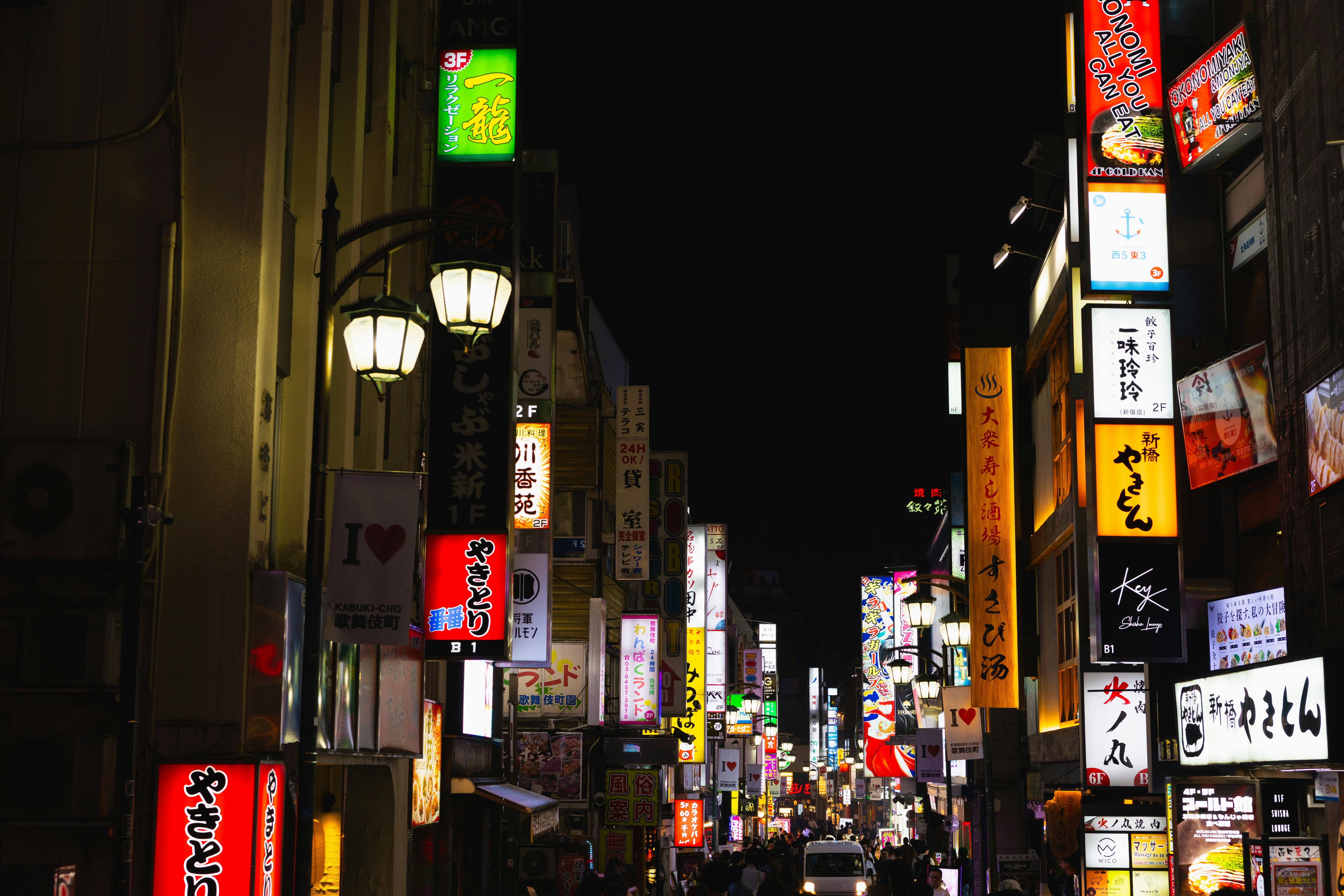 Neon Alley: Night Pulse in a Bustling Japanese Street