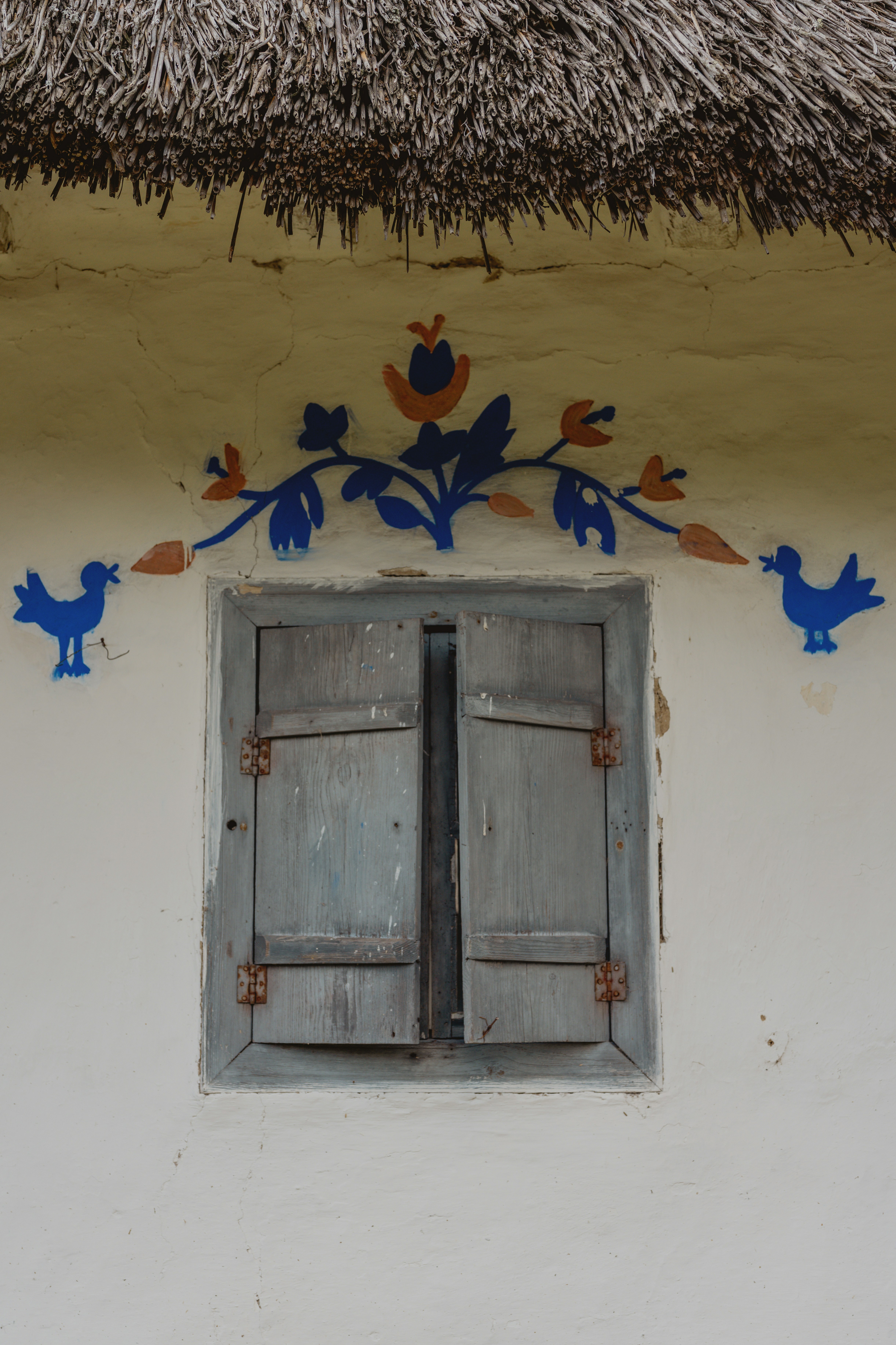 Blue Birds and a Weathered Window: Painted Simplicity