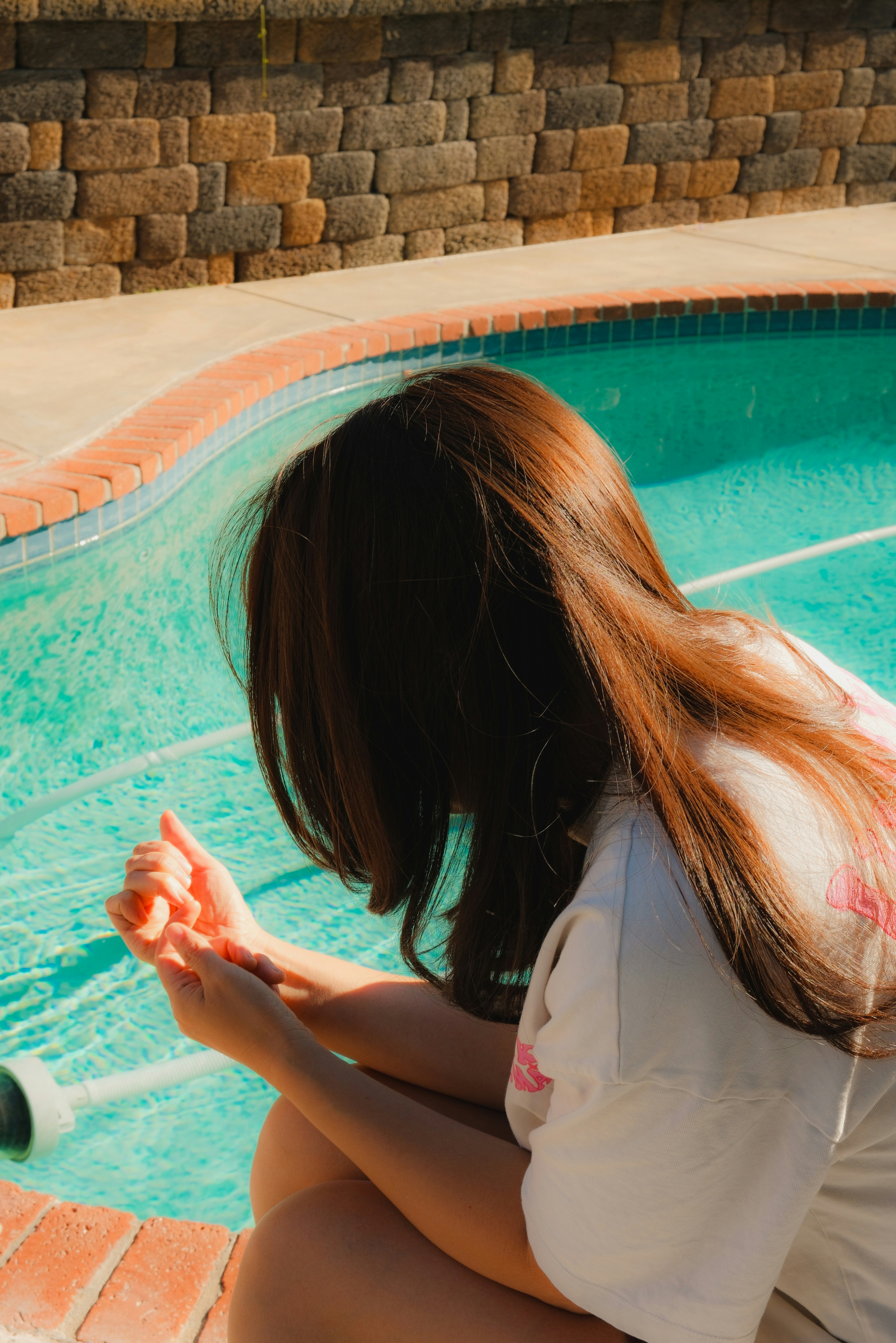 Sunlit Quiet: A Teen Lost in the Moment by the Pool
