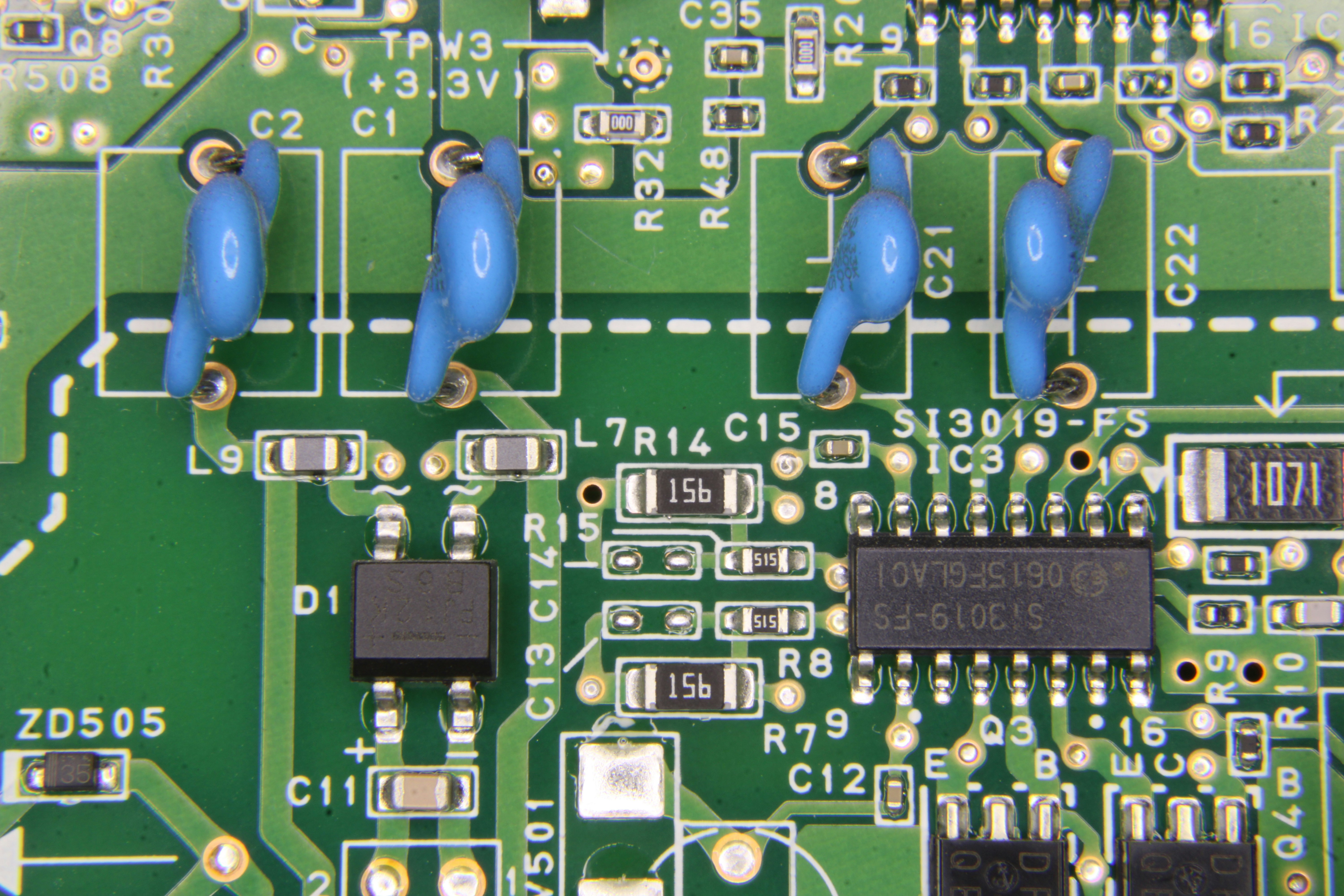Circuitry in Focus: Close-Up of a Green PCB with Components