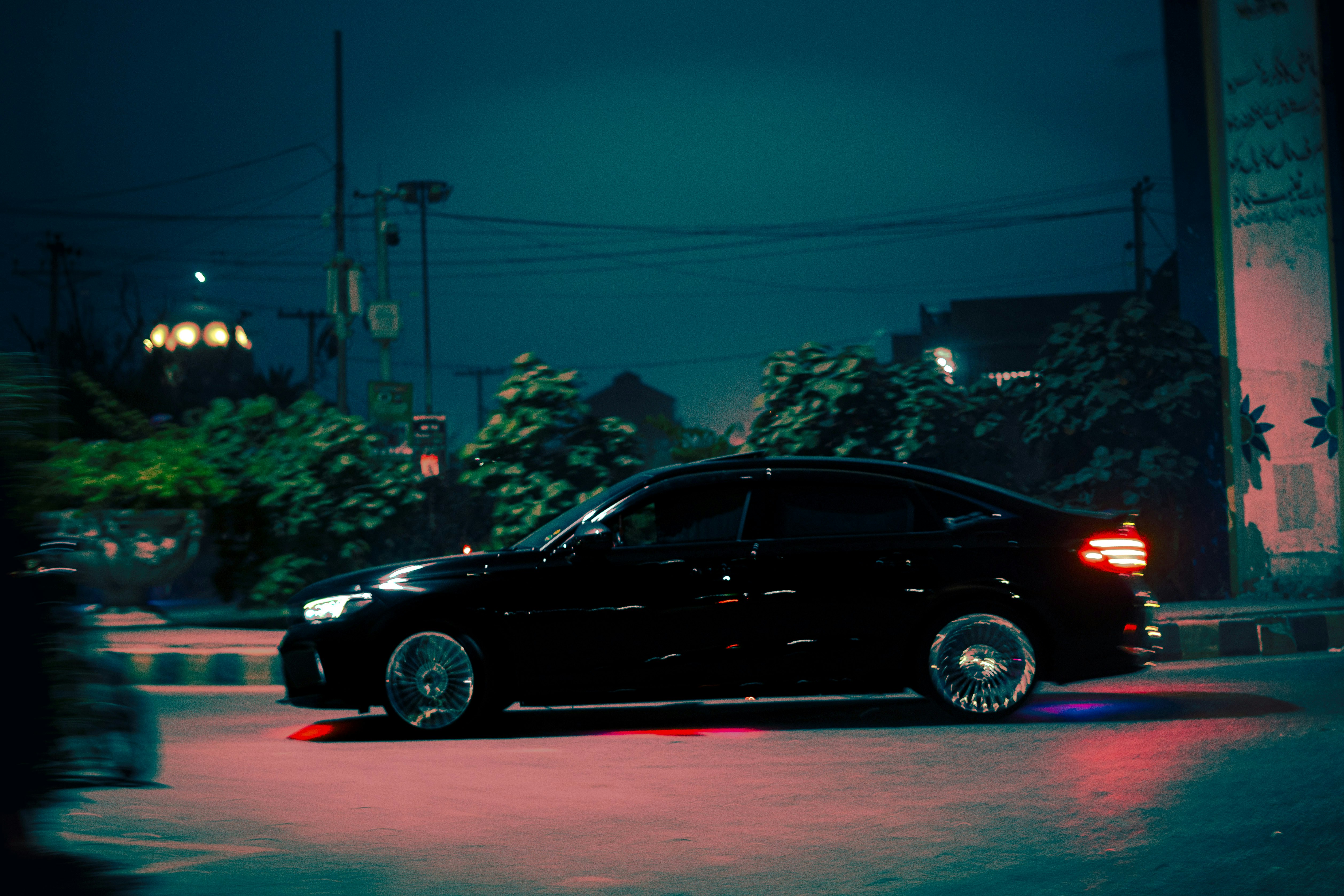 Neon-lit Midnight Sedan