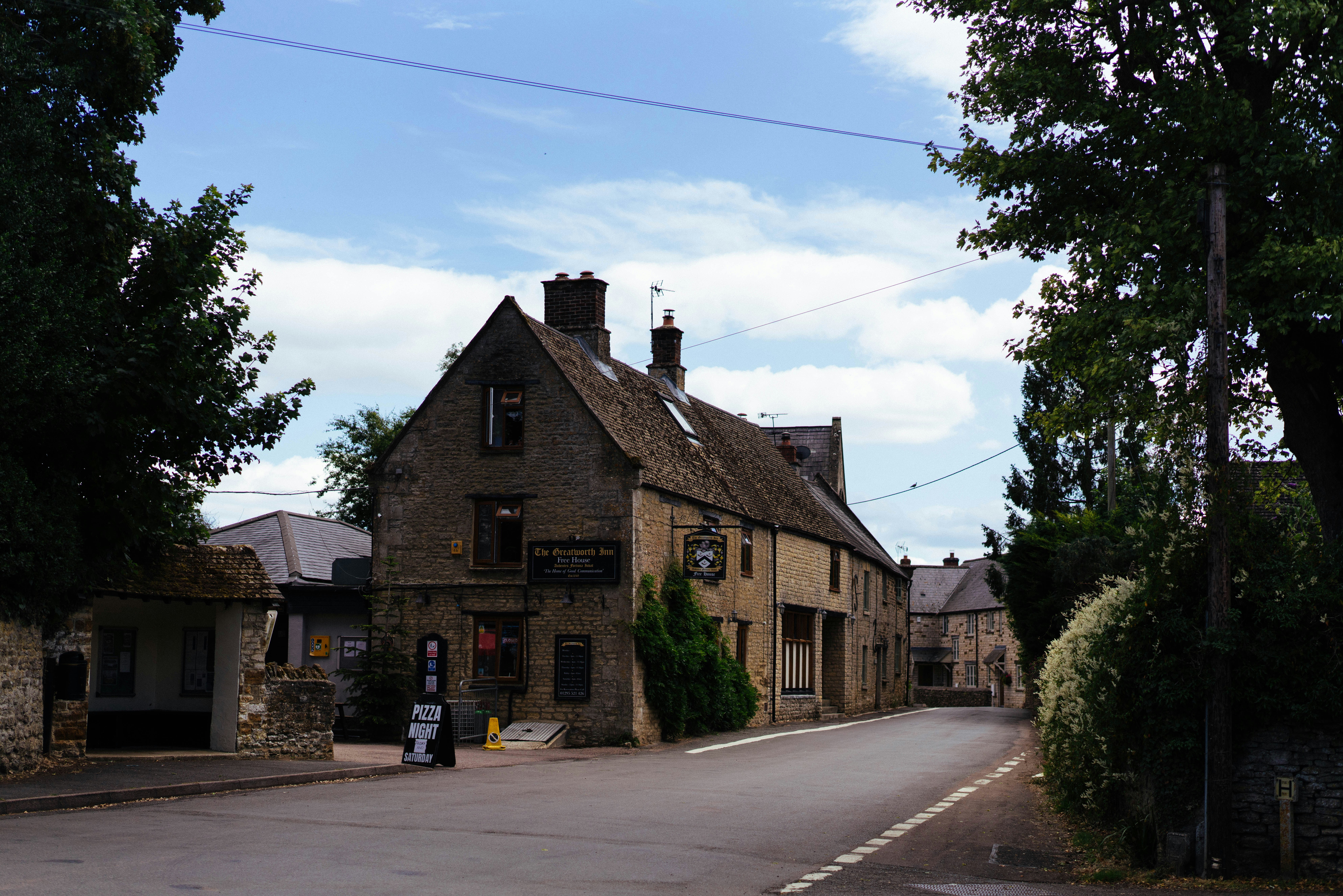 Quaint Village Street: Stone Cottage at the Bend
