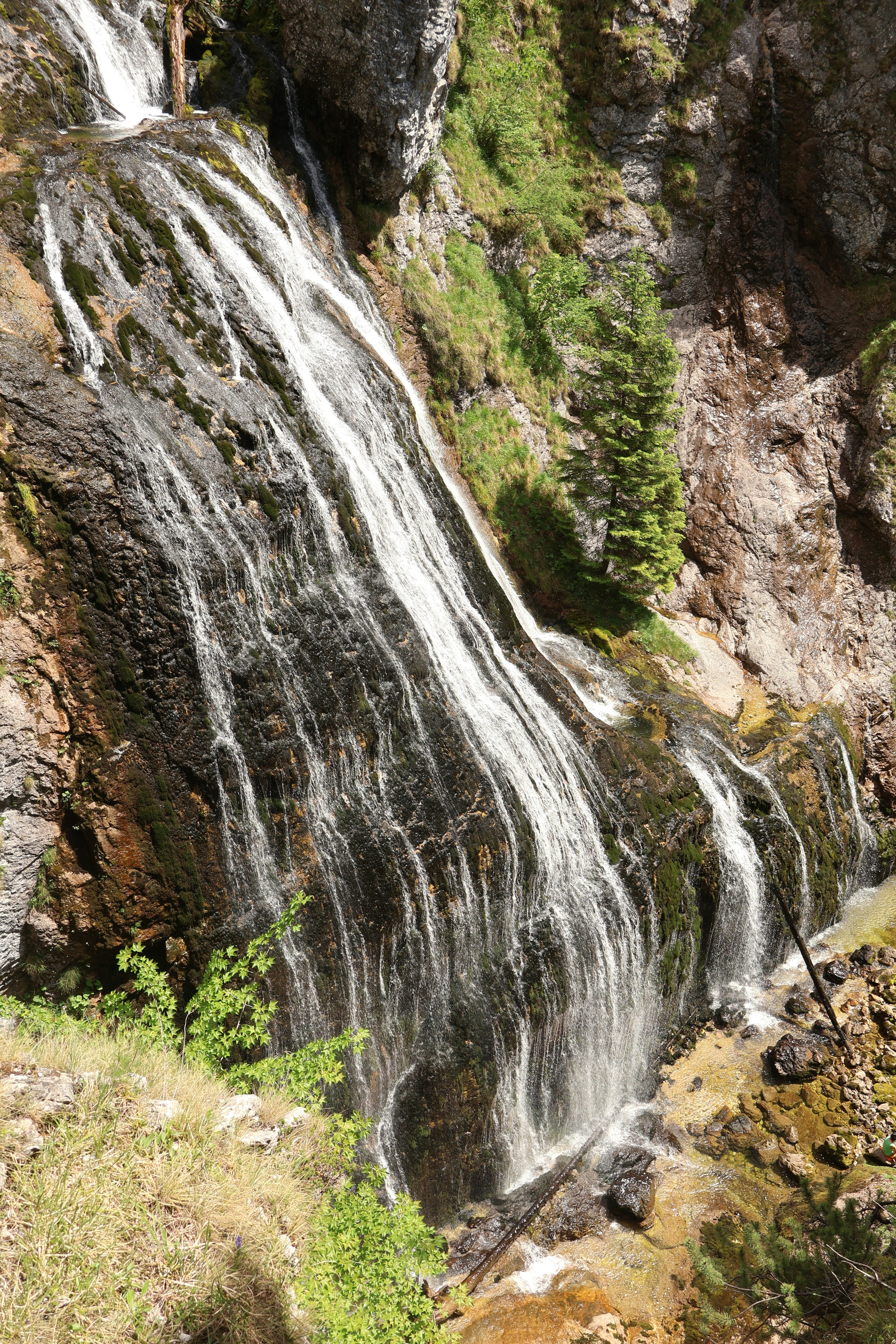 Cascade on the Cliff: A Bright Freefall to the Rock