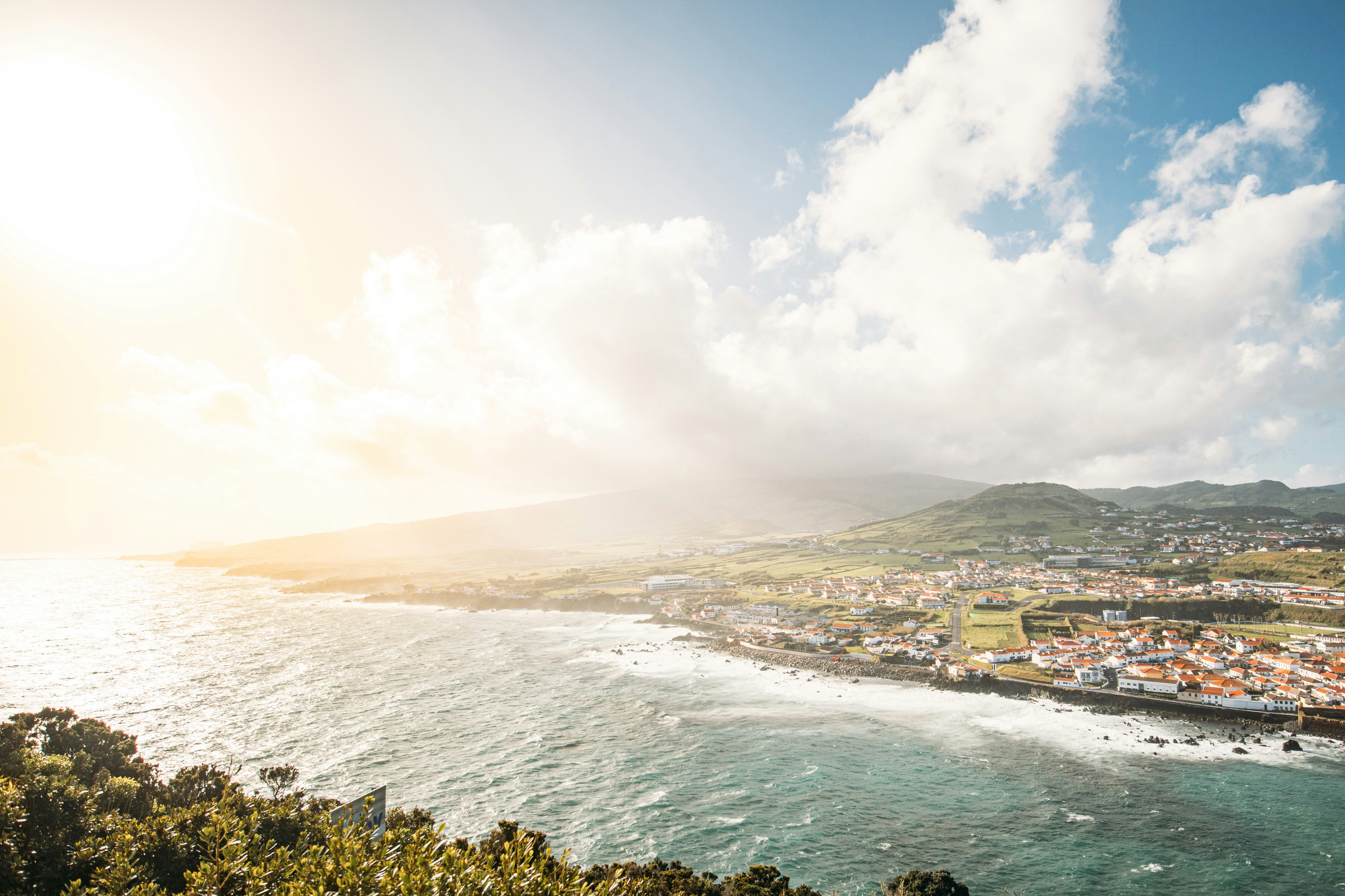 Golden Coastline at Sunrise: A Quiet Blend of Ocean and Town