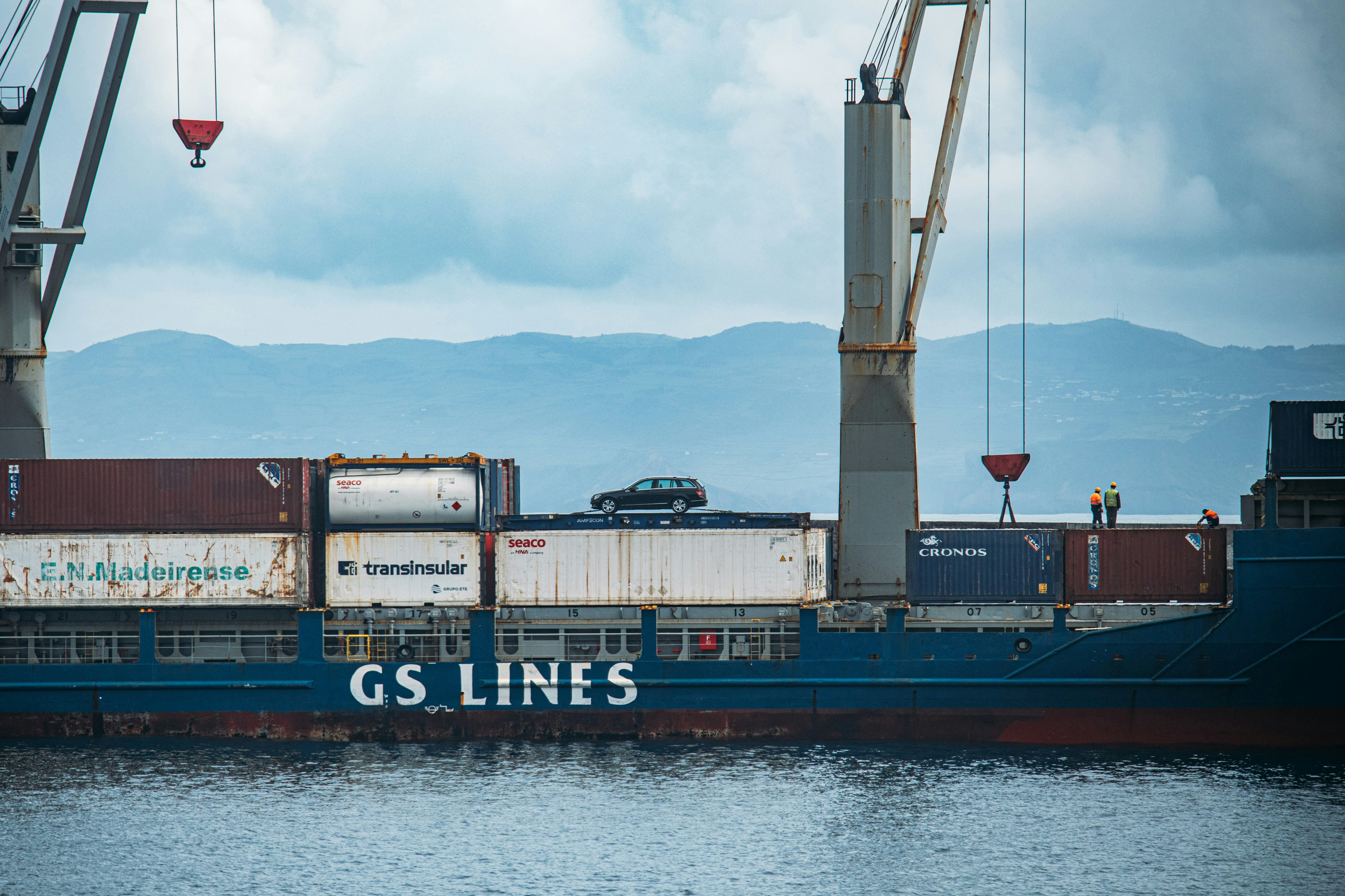 Toward the Horizon: A Container Vessel Resting by the Quiet Dock