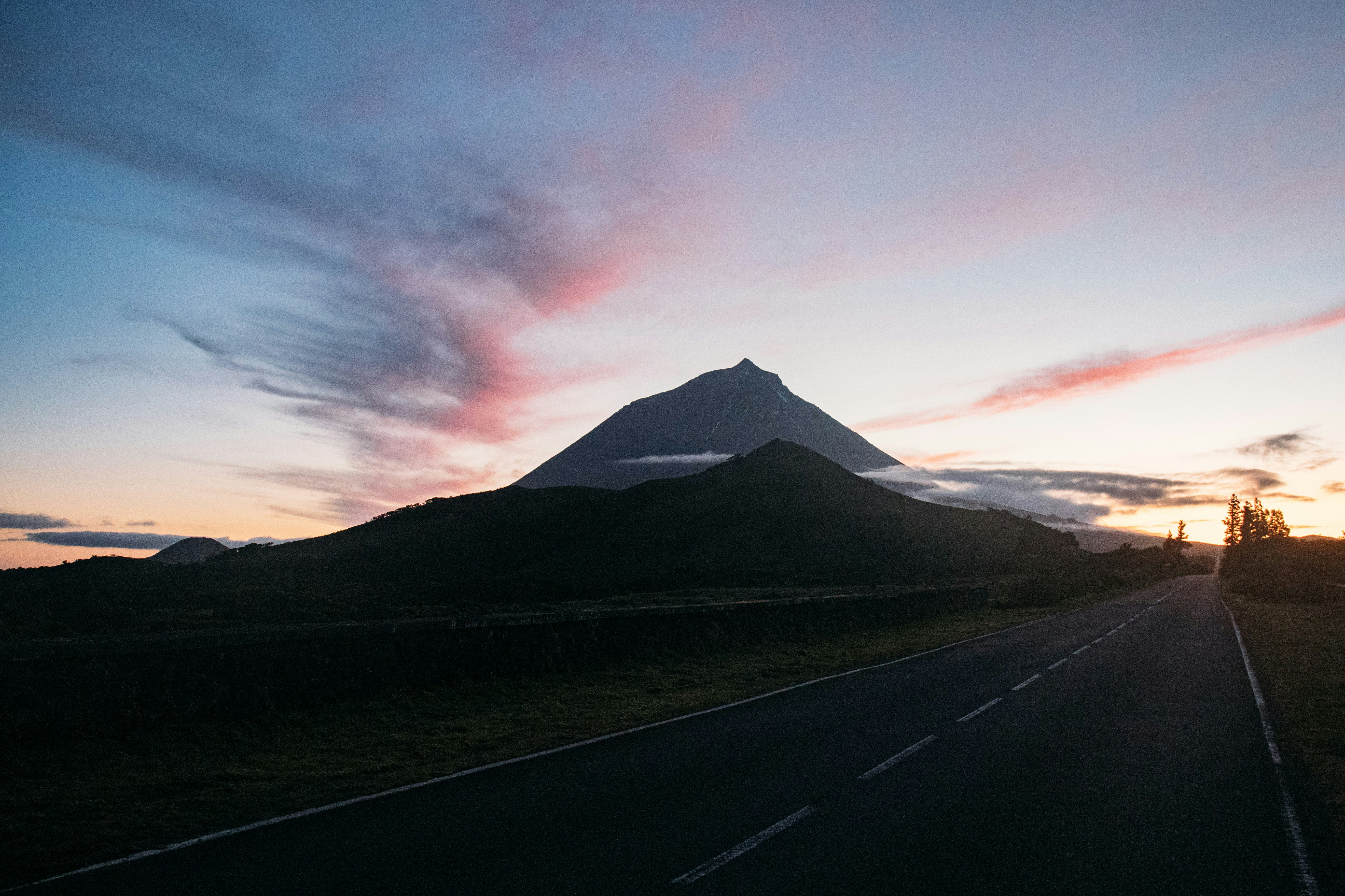Distant Peak Framed by an Open Road at Sunset