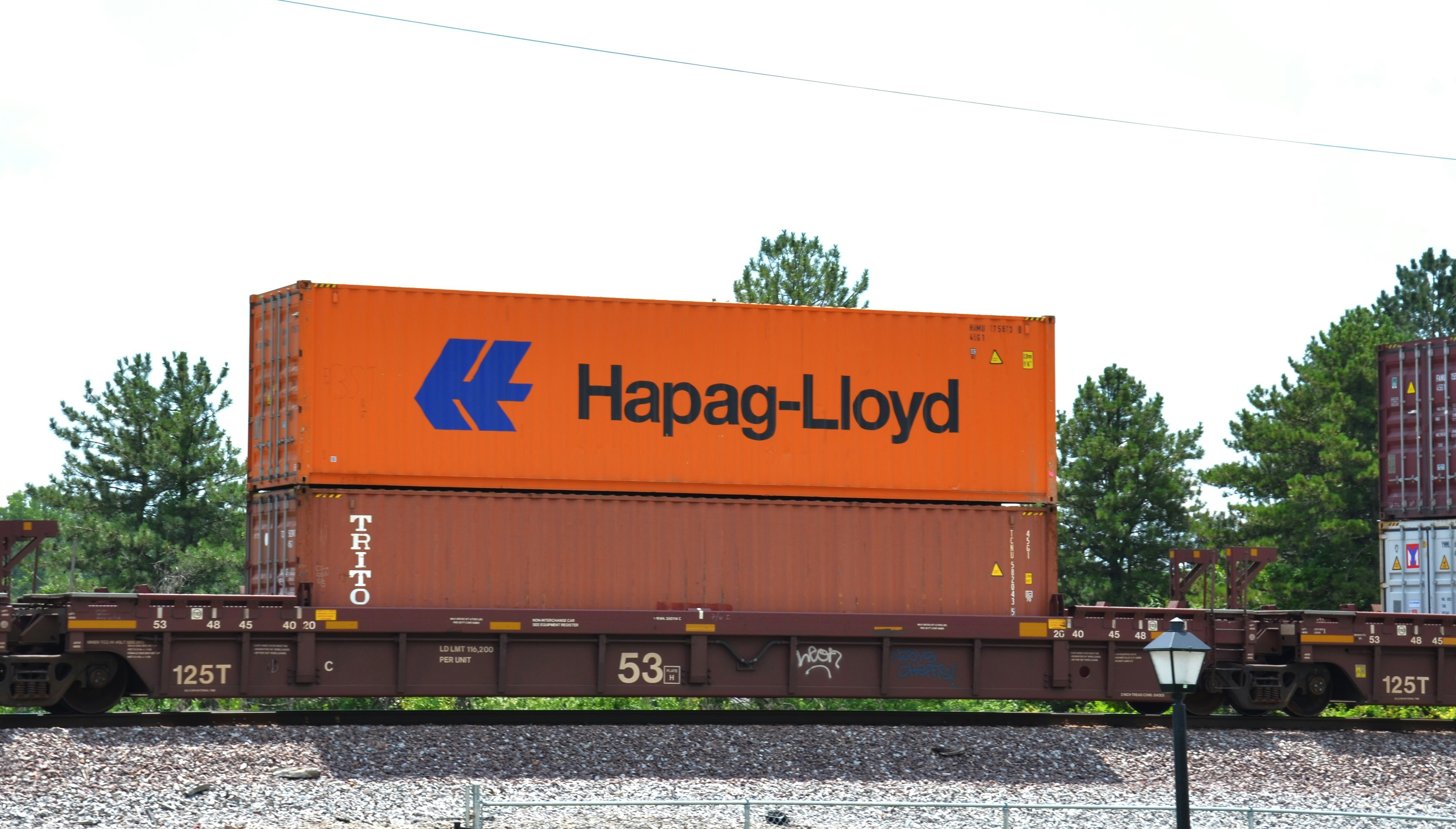 The Orange Box: A Hapag-Lloyd container on a rusted rail car